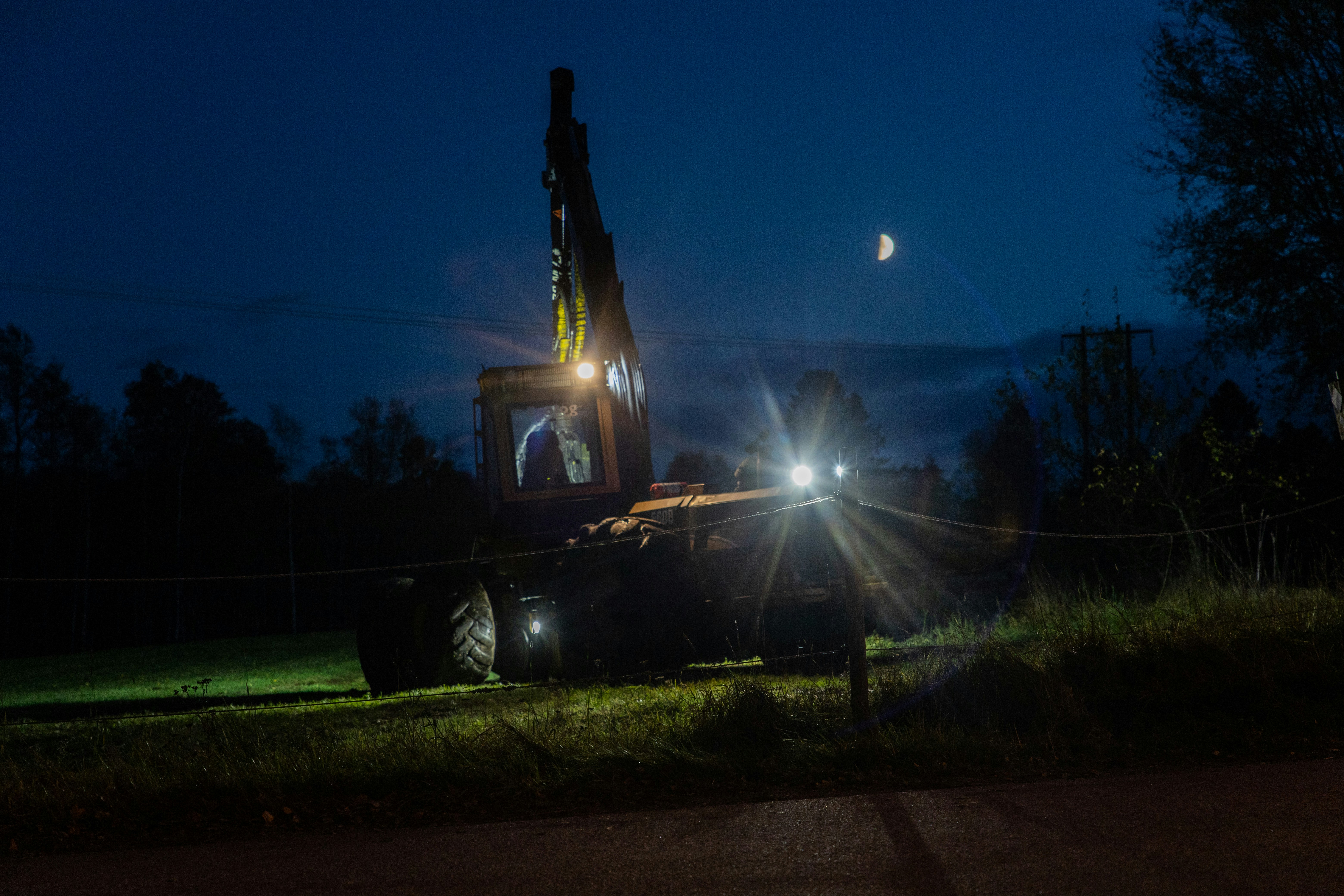 Man working late in the moonlight