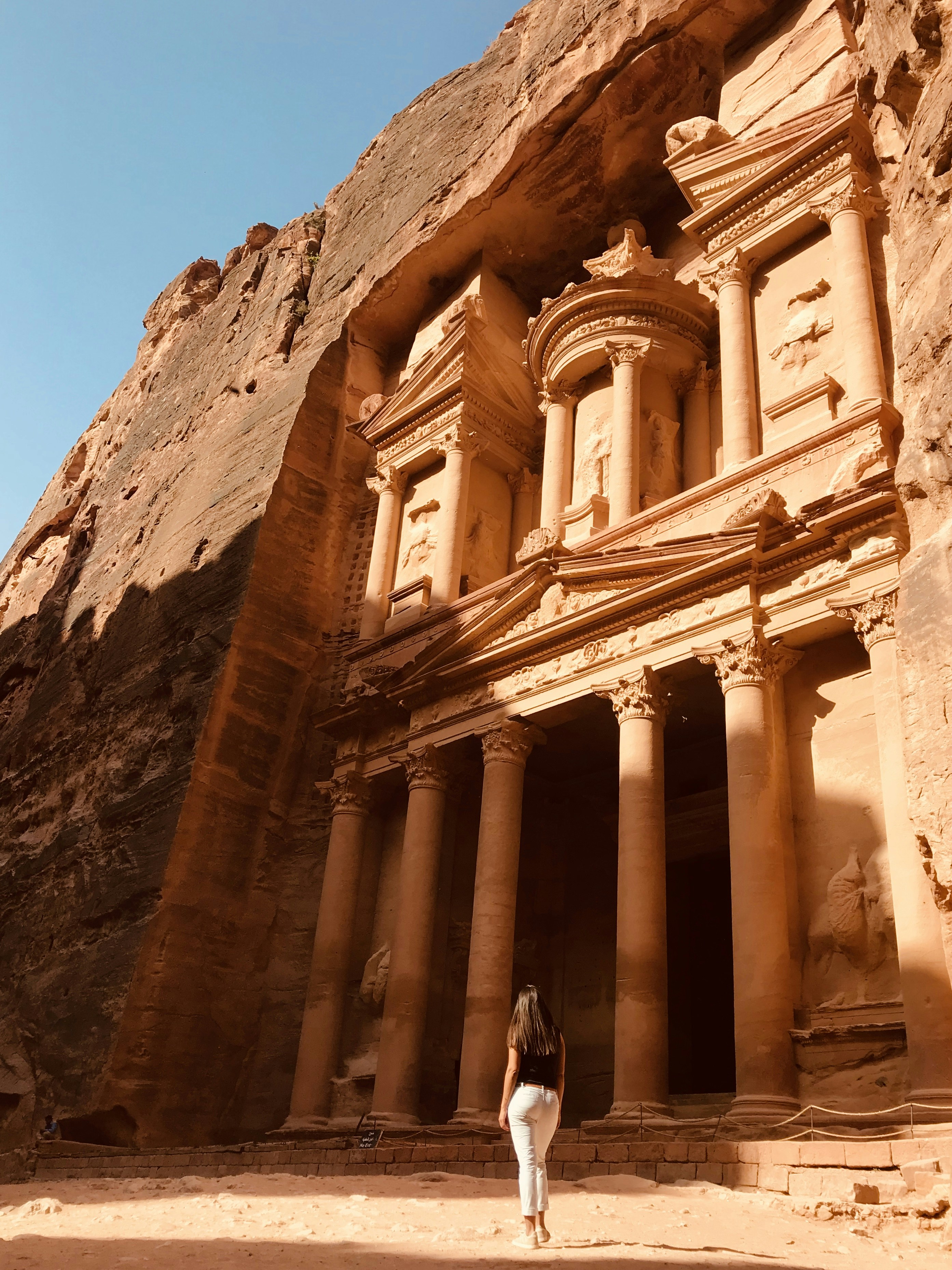 Traveler at the Carved Facade: Doorway to Petra-like Monolith