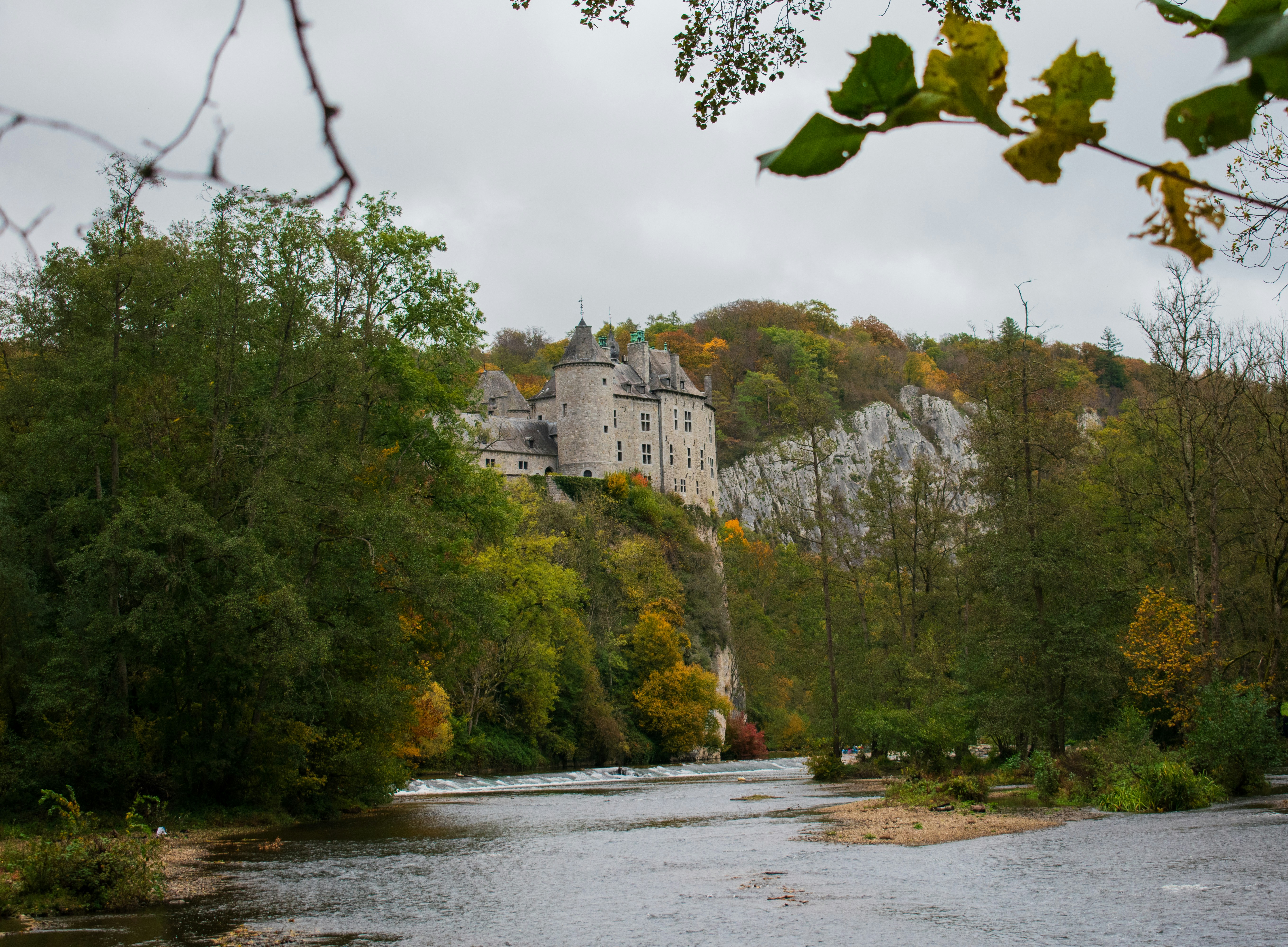 Clifftop Castle Framed by Autumn River