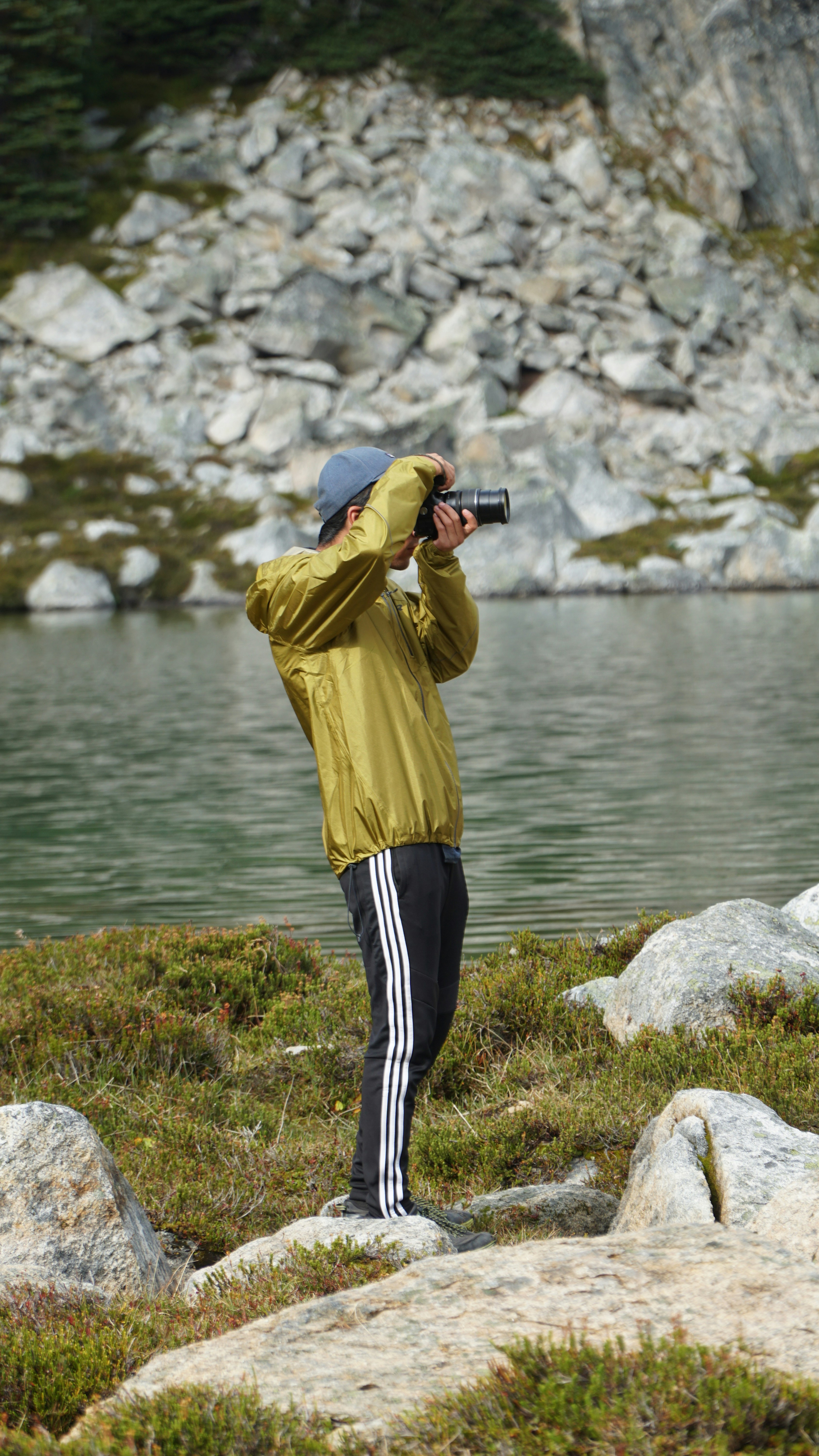 Lone Photographer on a Granite Shore
