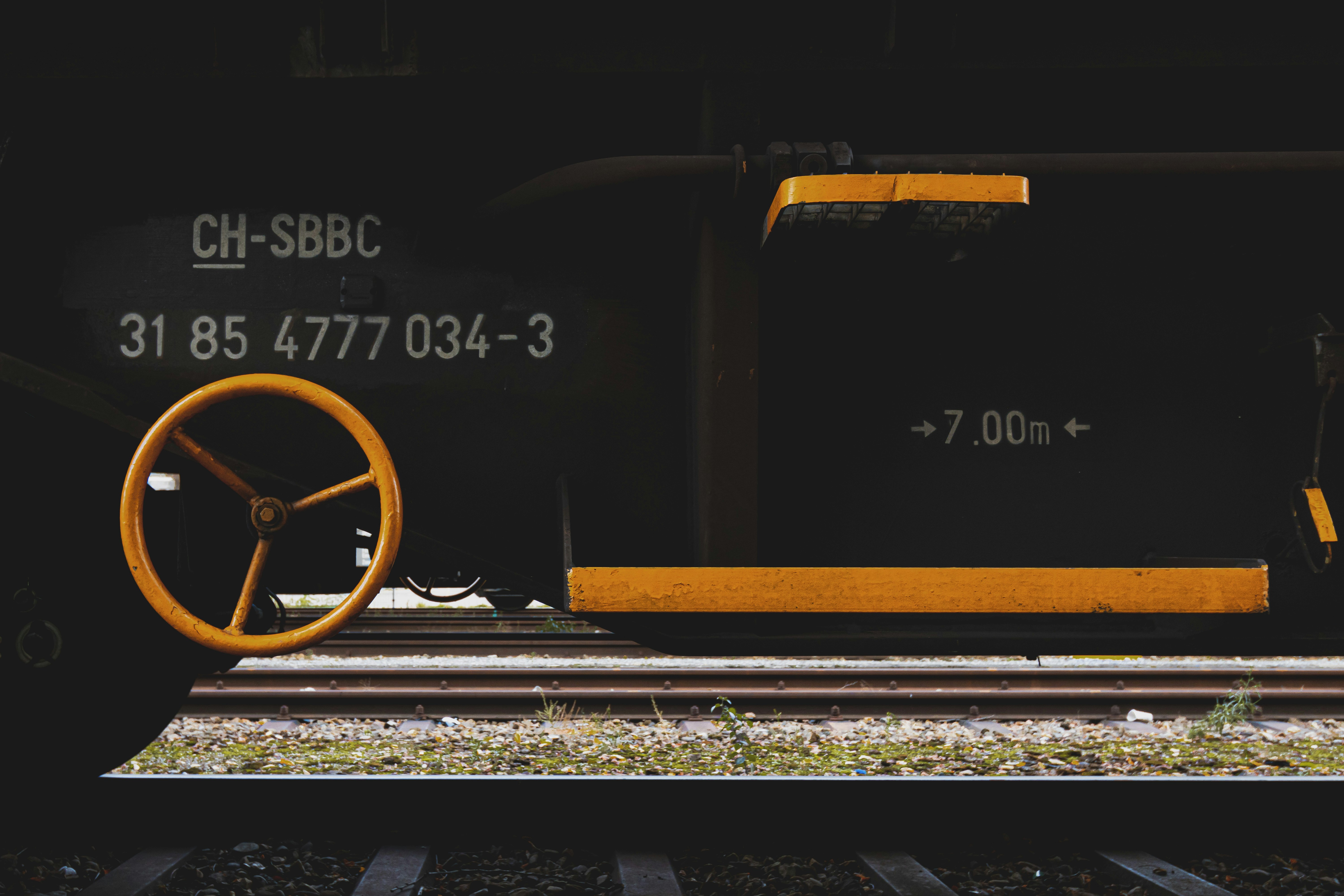 Orange Wheel on a Weathered Railcar: A Quiet Study in Industrial Geometry