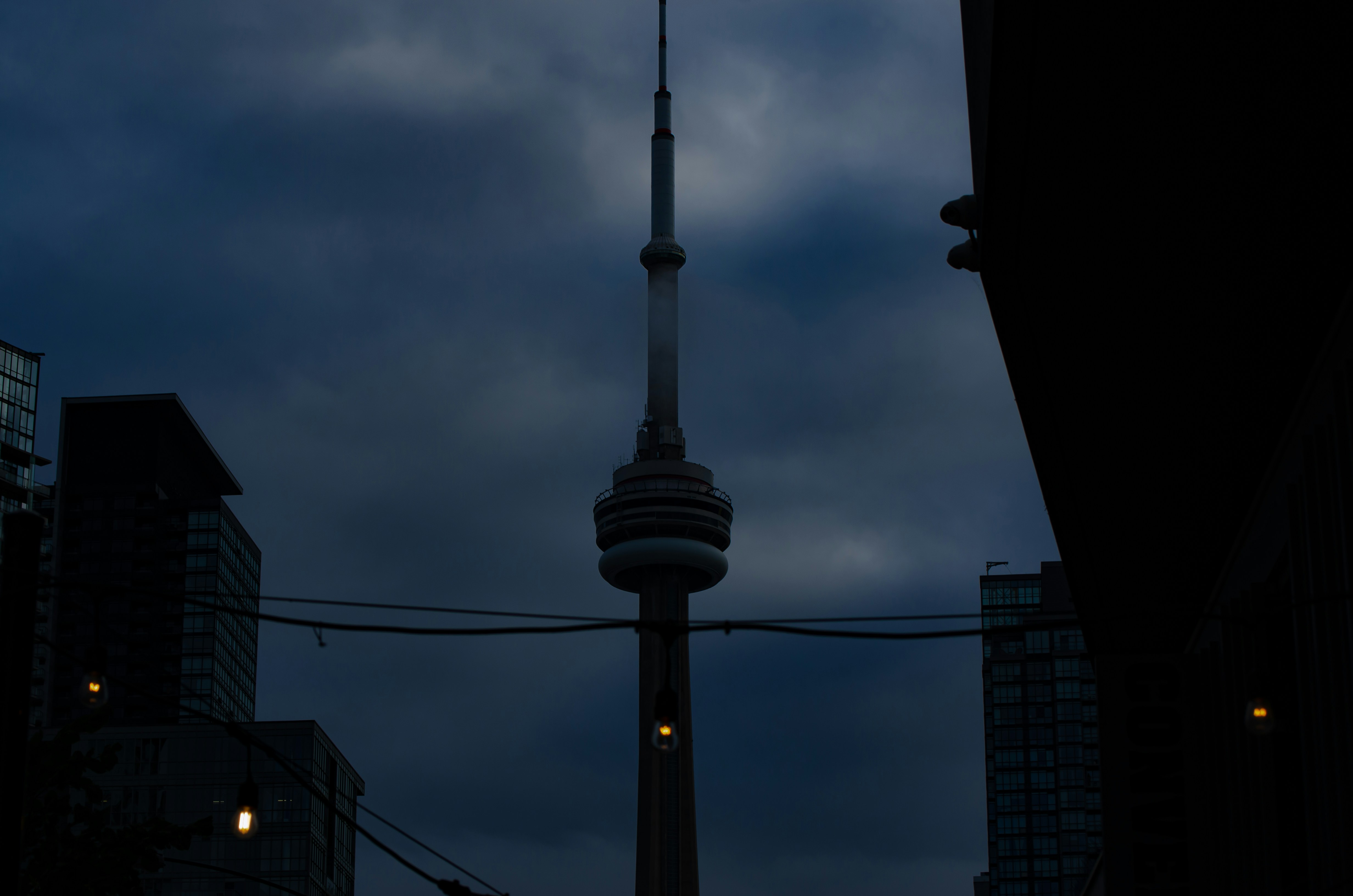 silhouette of tower under cloudy sky