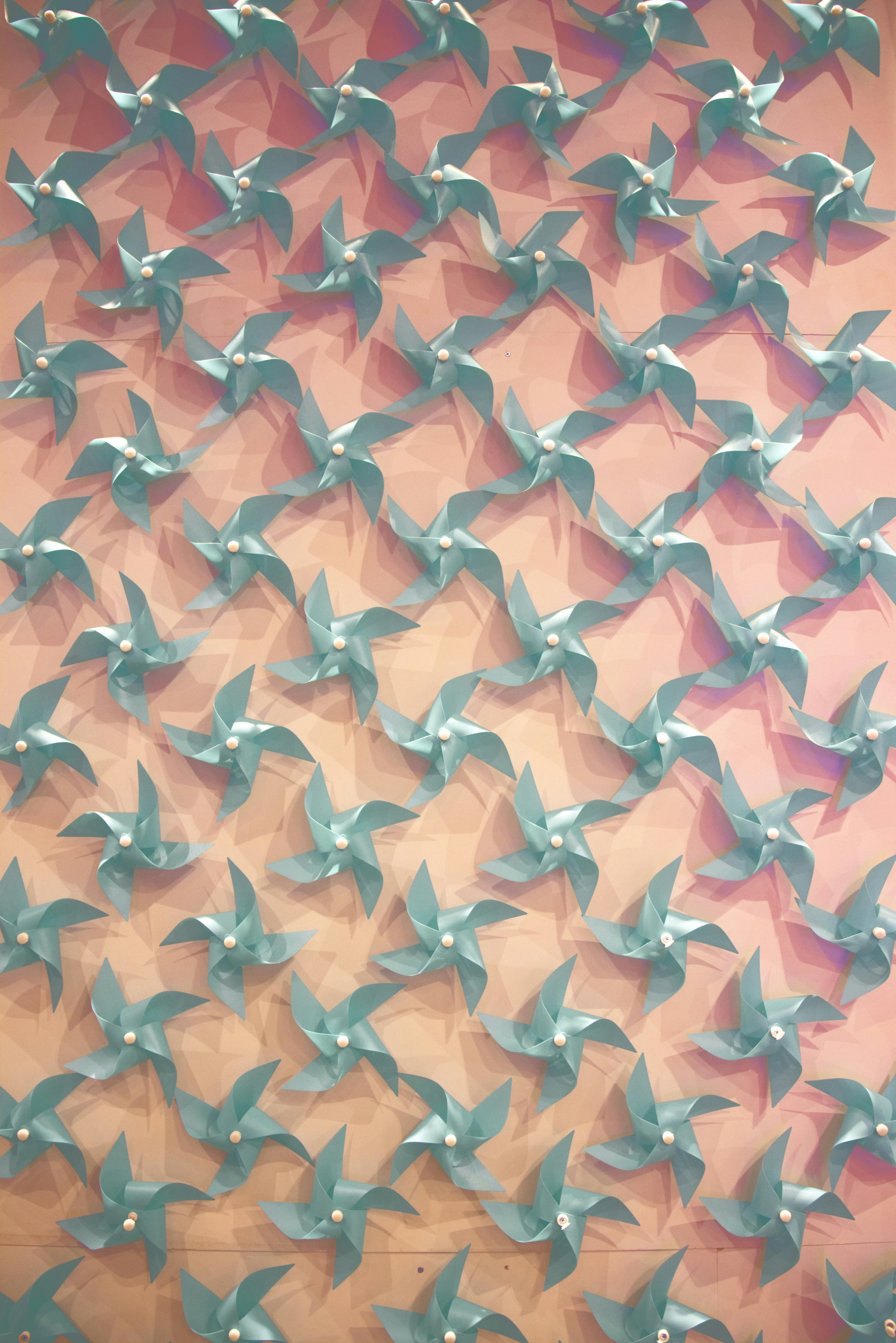 Teal Pinwheels Weave a Peach Sunset Mosaic