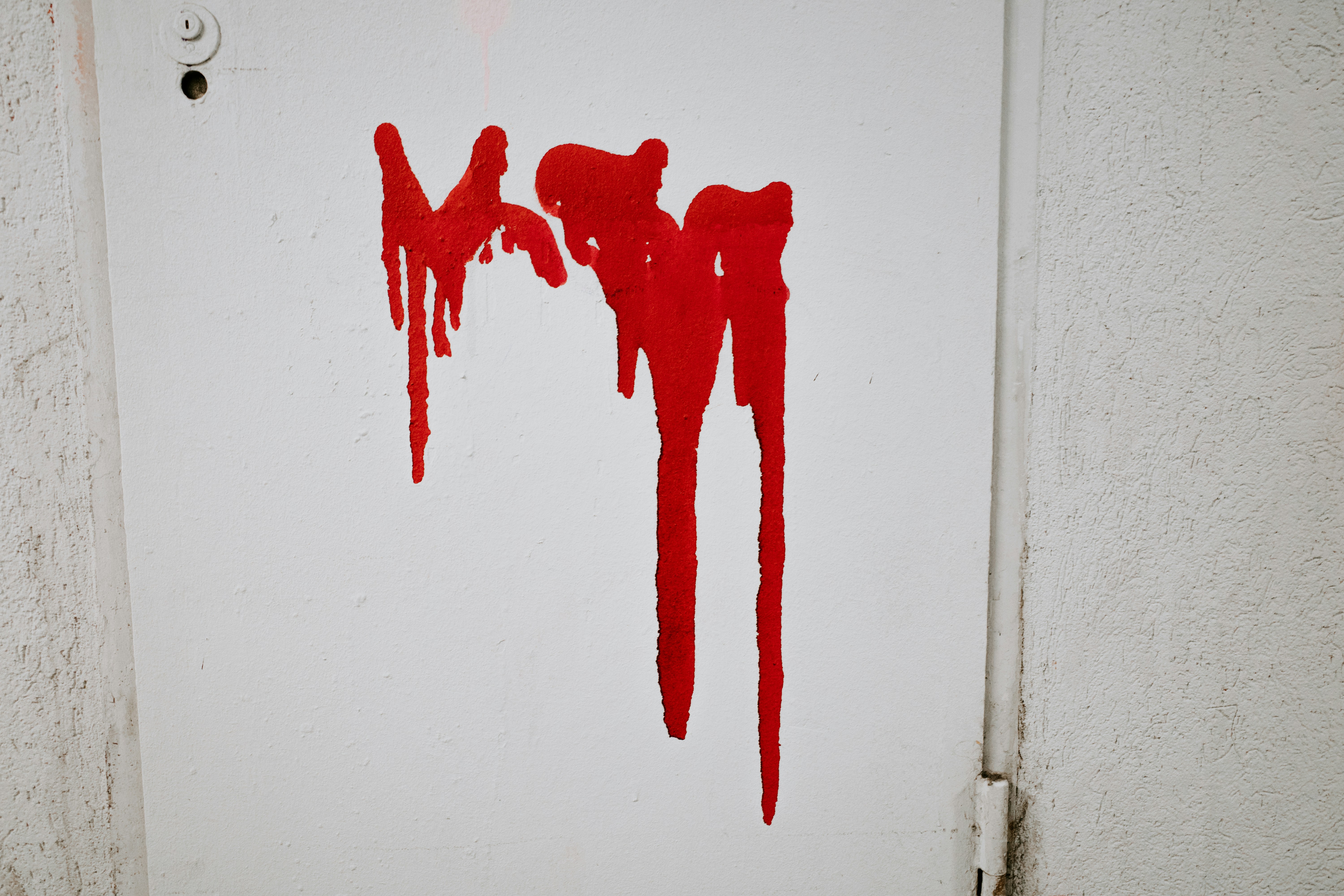 Red hand drawing on white wall photo – Free Zurich Image on Unsplash