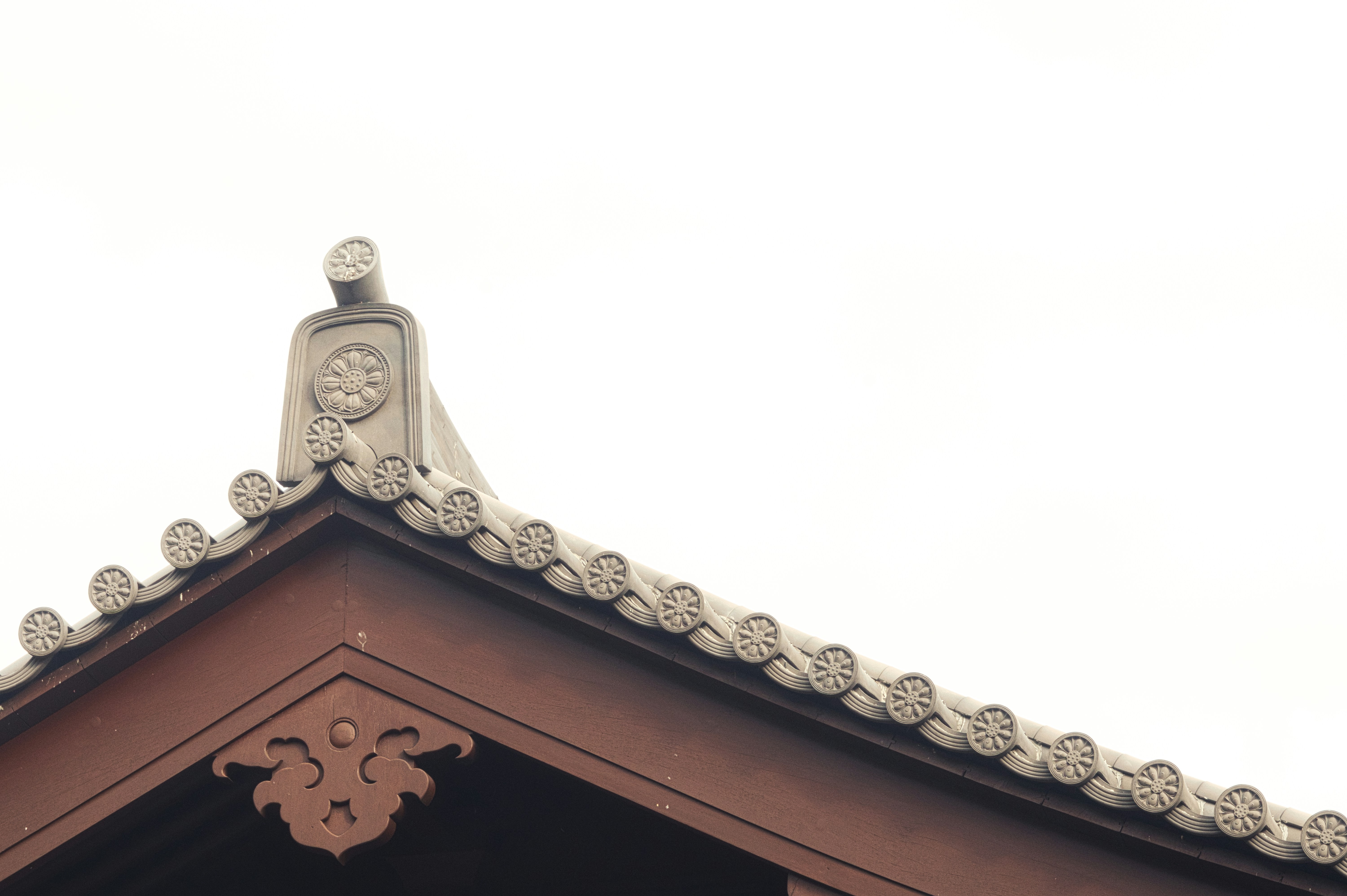 brown wooden roof under white sky during daytime