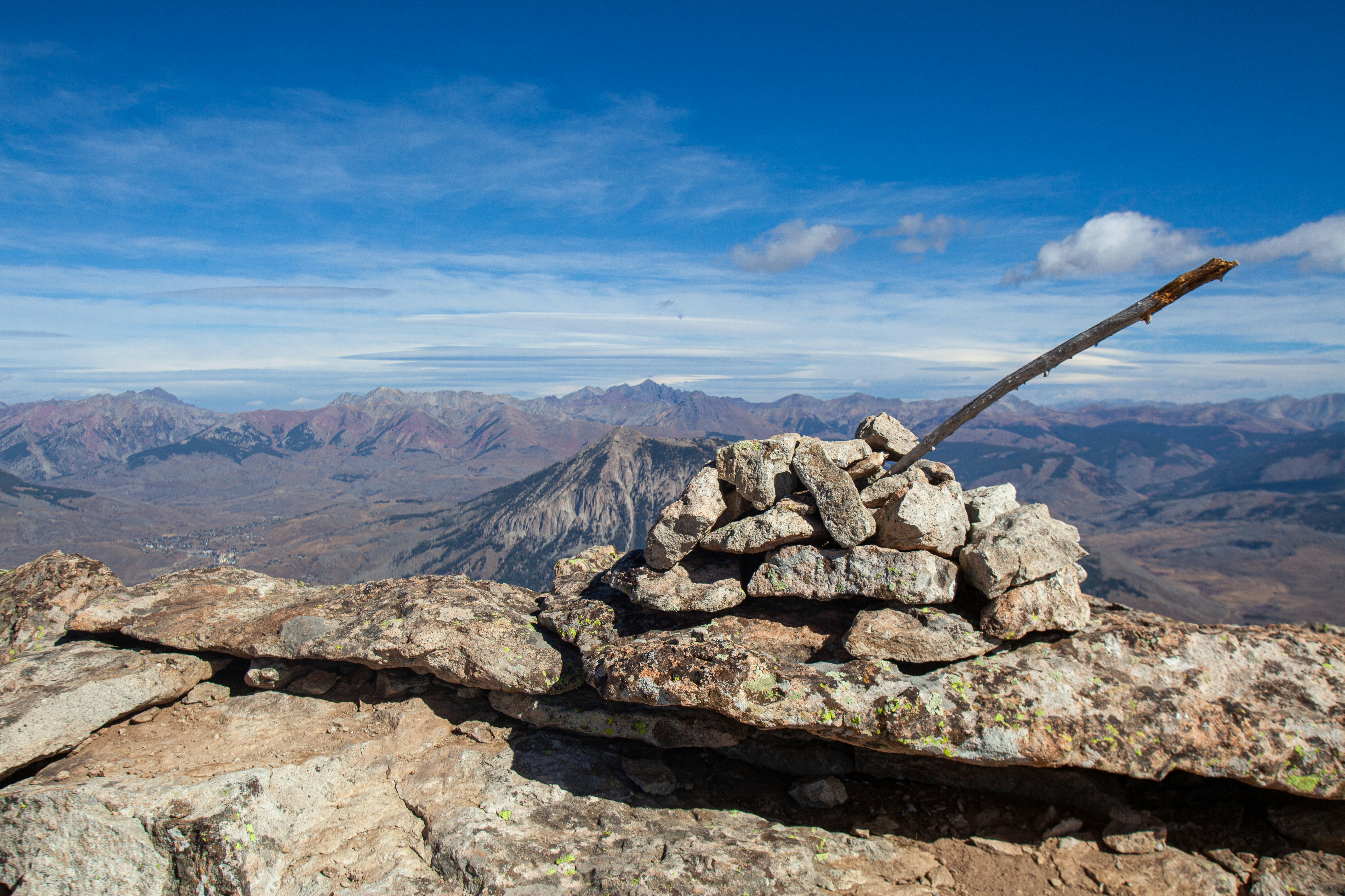 Cairn and Wand: A Weathered Marker Over the Alpine Horizon