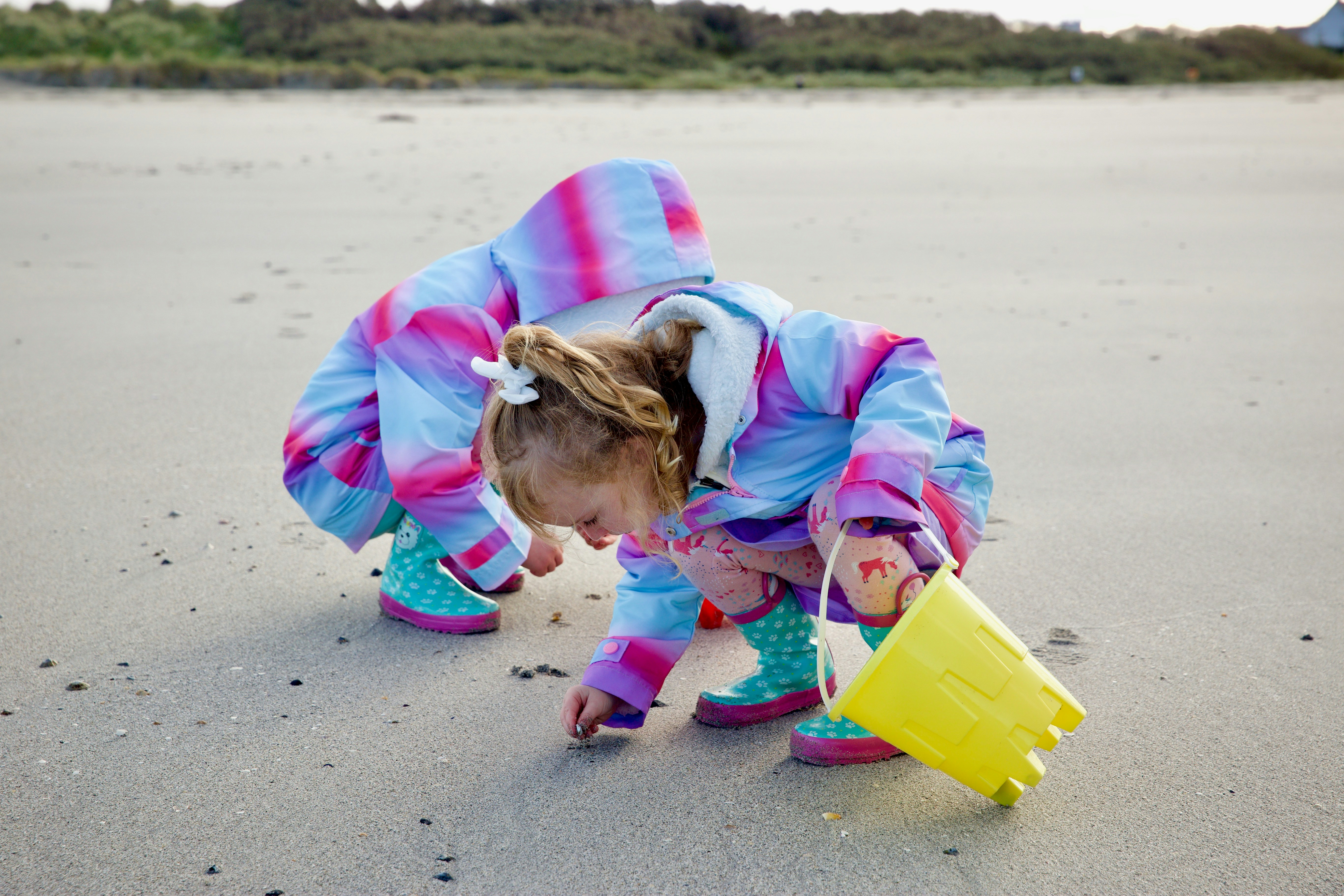 Little Beach Explorer in Striped Raincoat Dumps Digging Sand