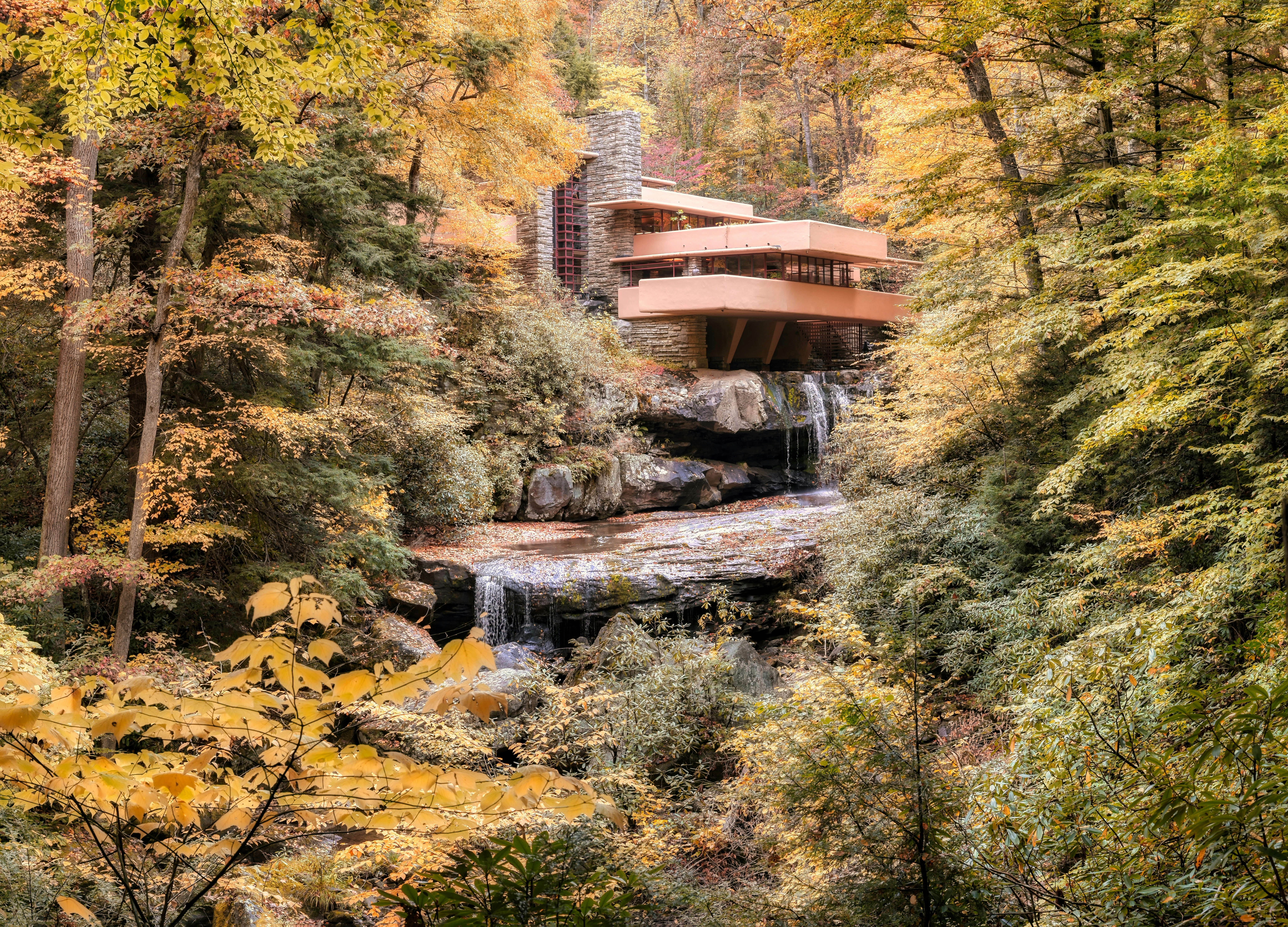 Autumn Cantilever: A Modern Retreat Above a Forest Cascade