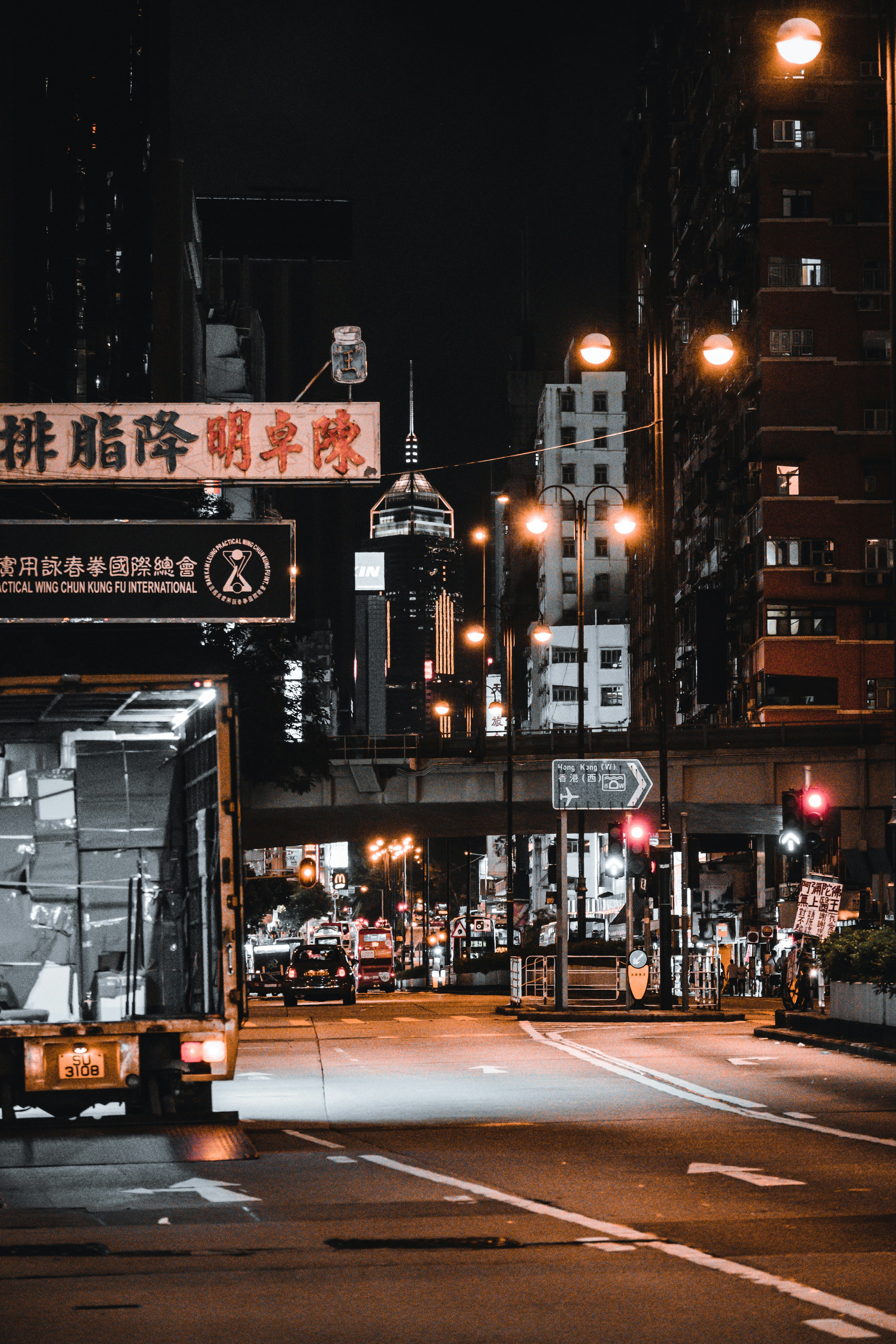Neon Crossroads Beneath the Overpass: A Midnight City Street