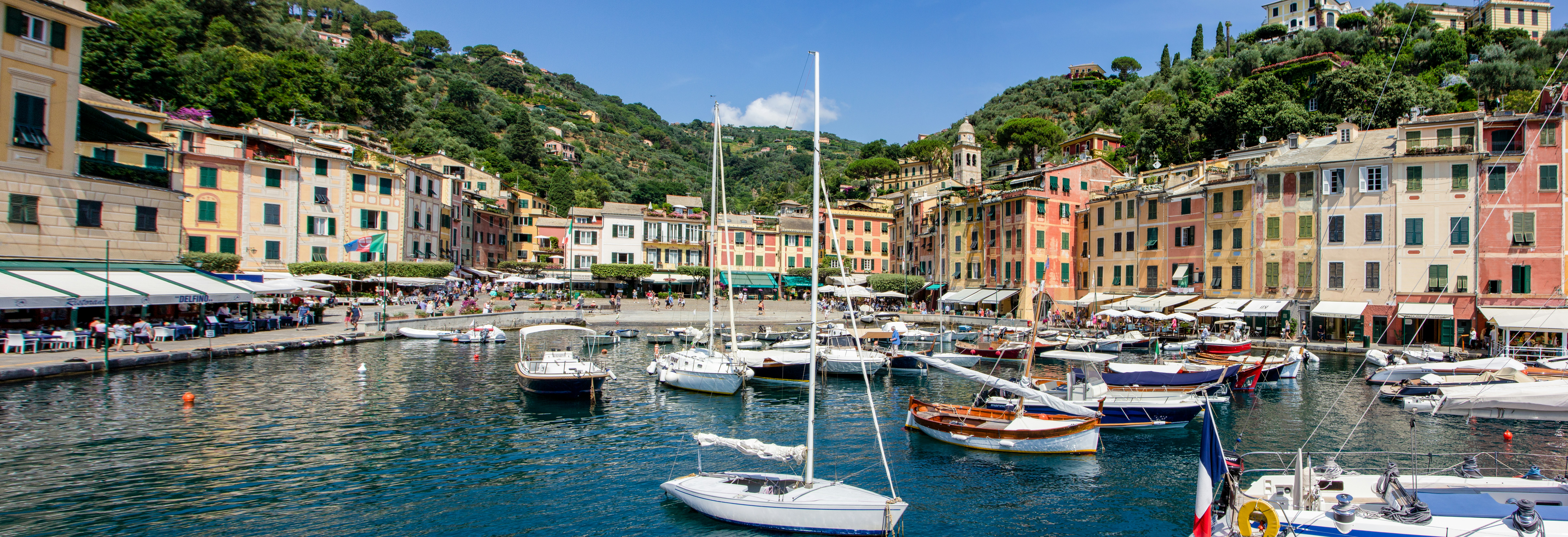 Pastel Harborfront: Sails, Water, and Colorful Quay Architecture