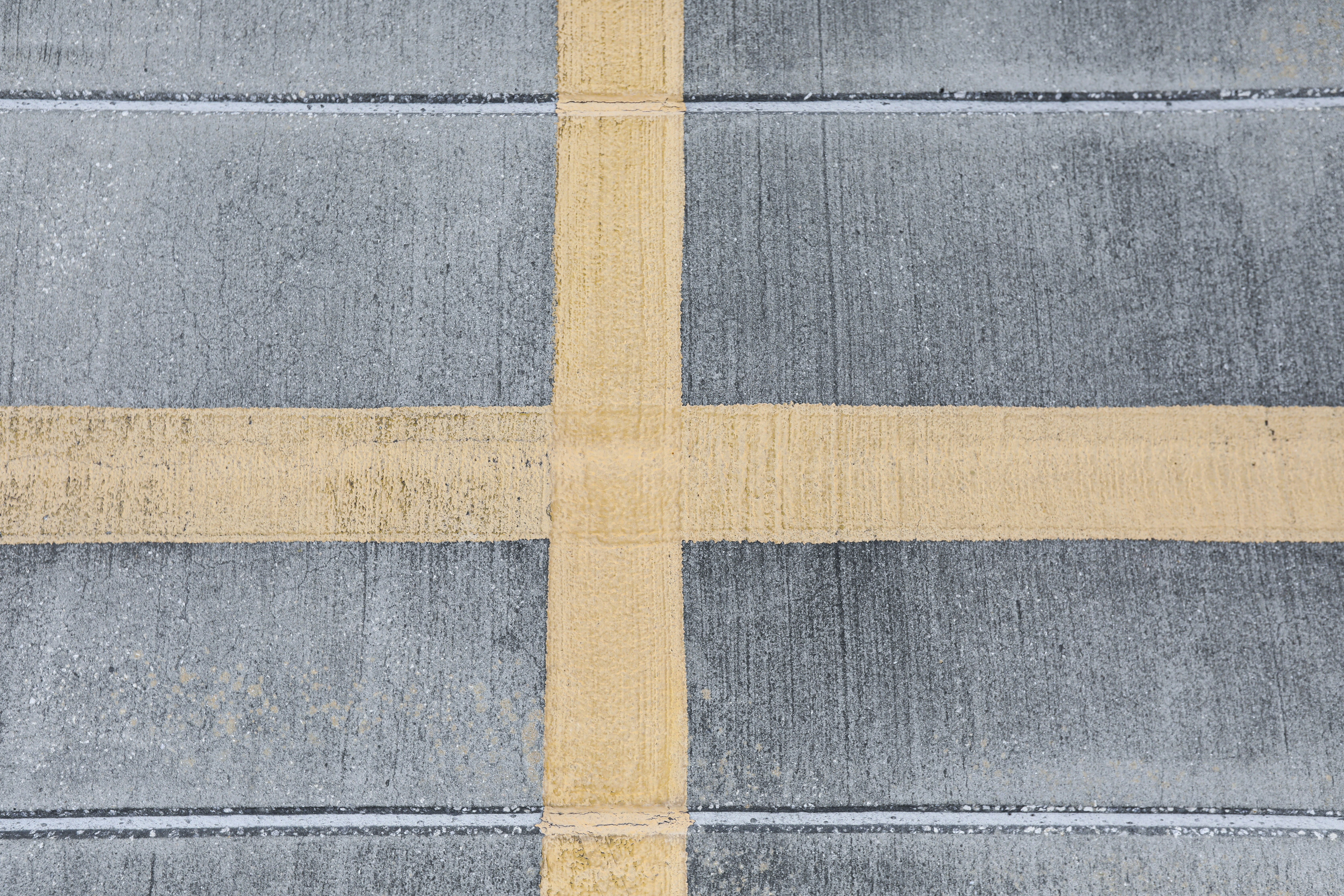 Yellow Crossroads: Geometry in Weathered Concrete