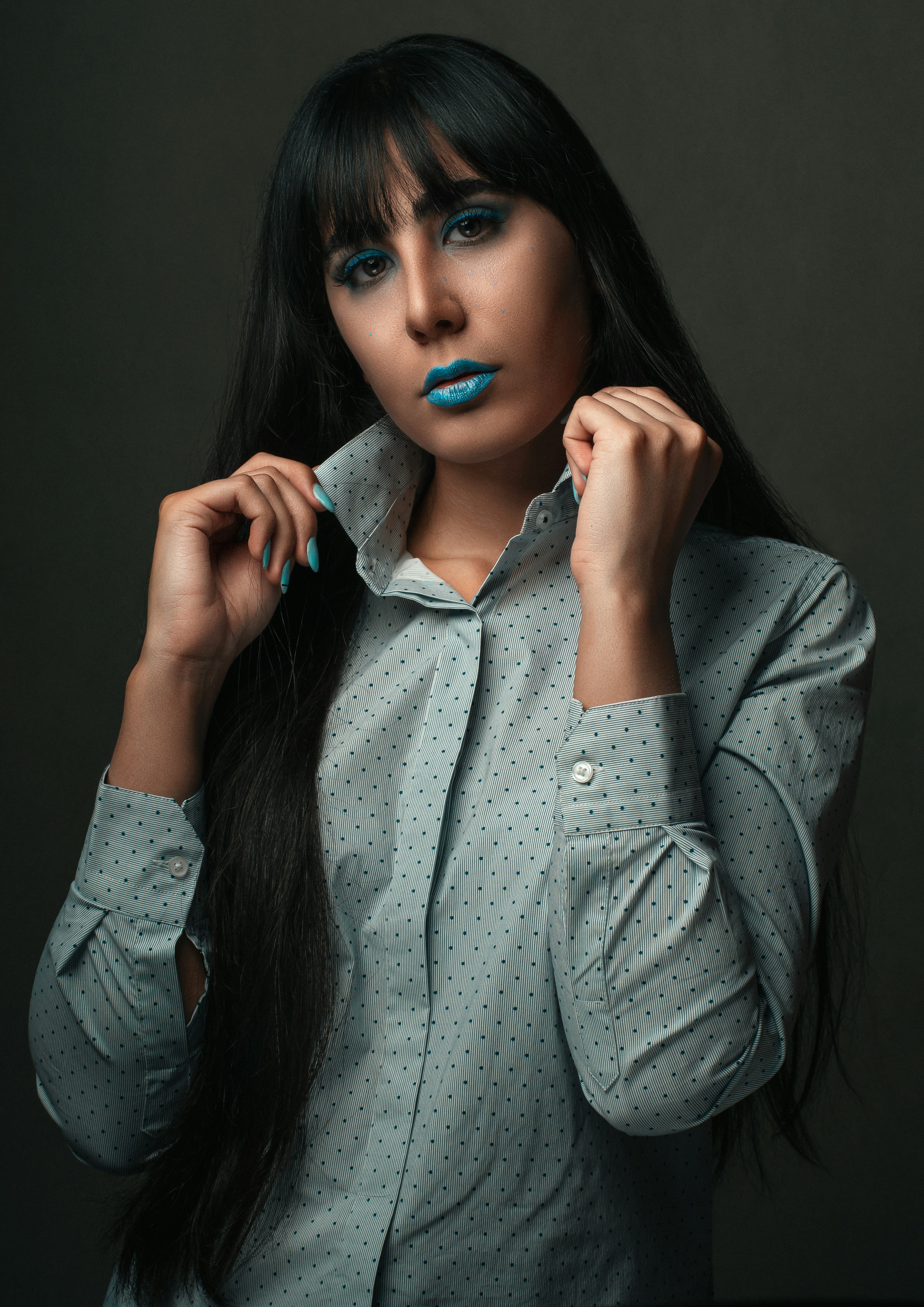 woman in gray button up long sleeve shirt