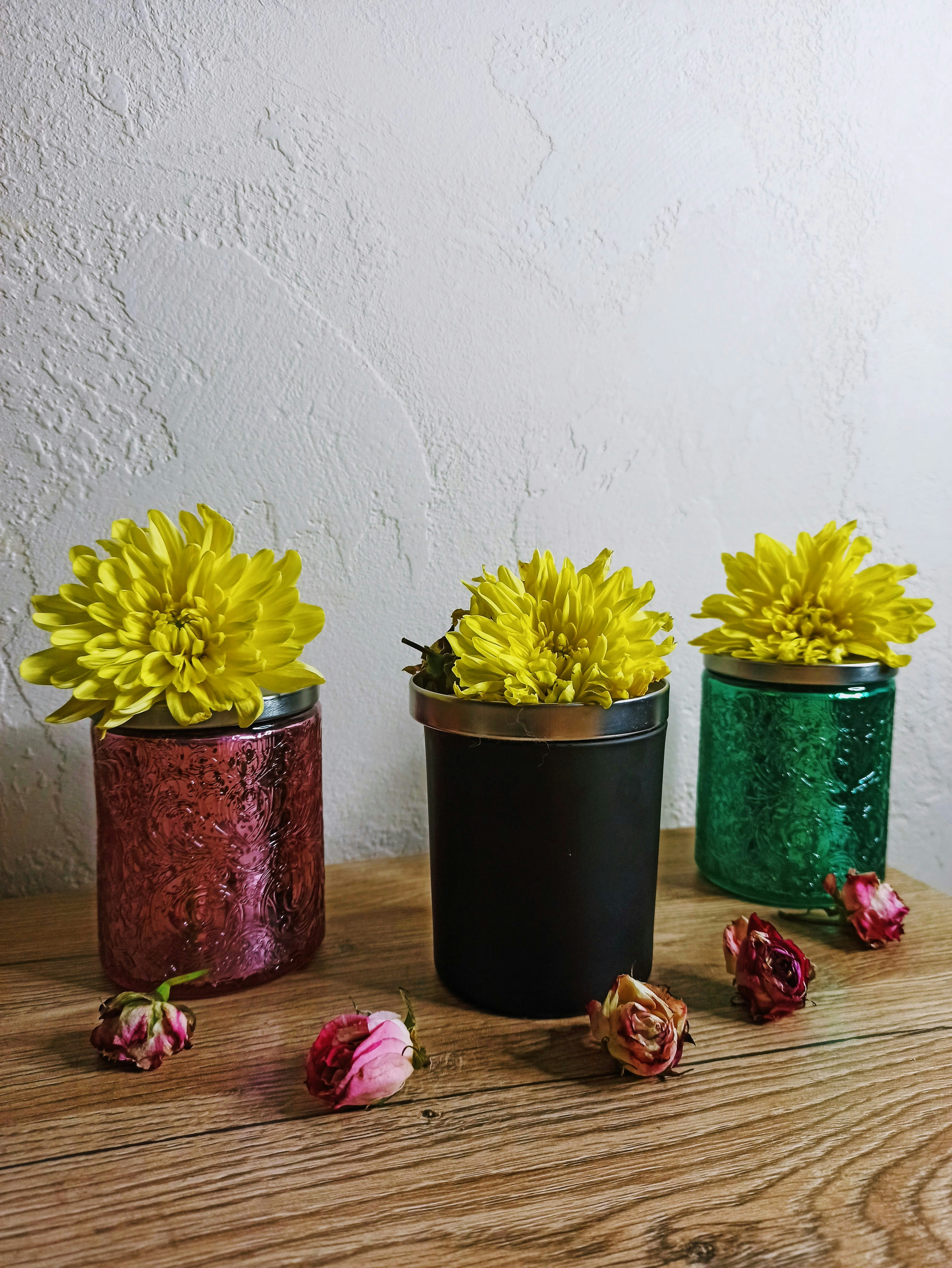 yellow and pink flower on blue and brown ceramic vase