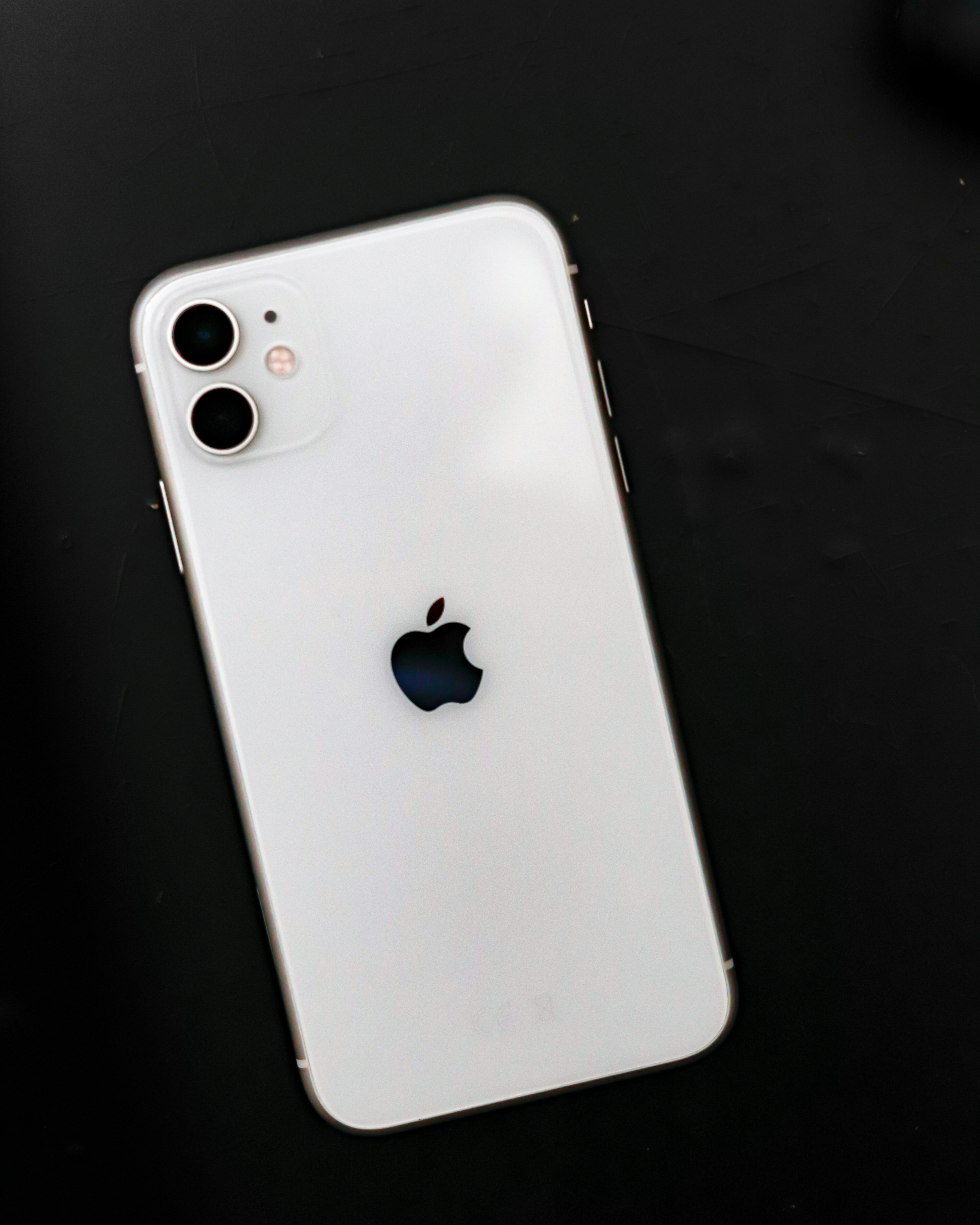 Iphone 11 | white iphone 5 c on black surface