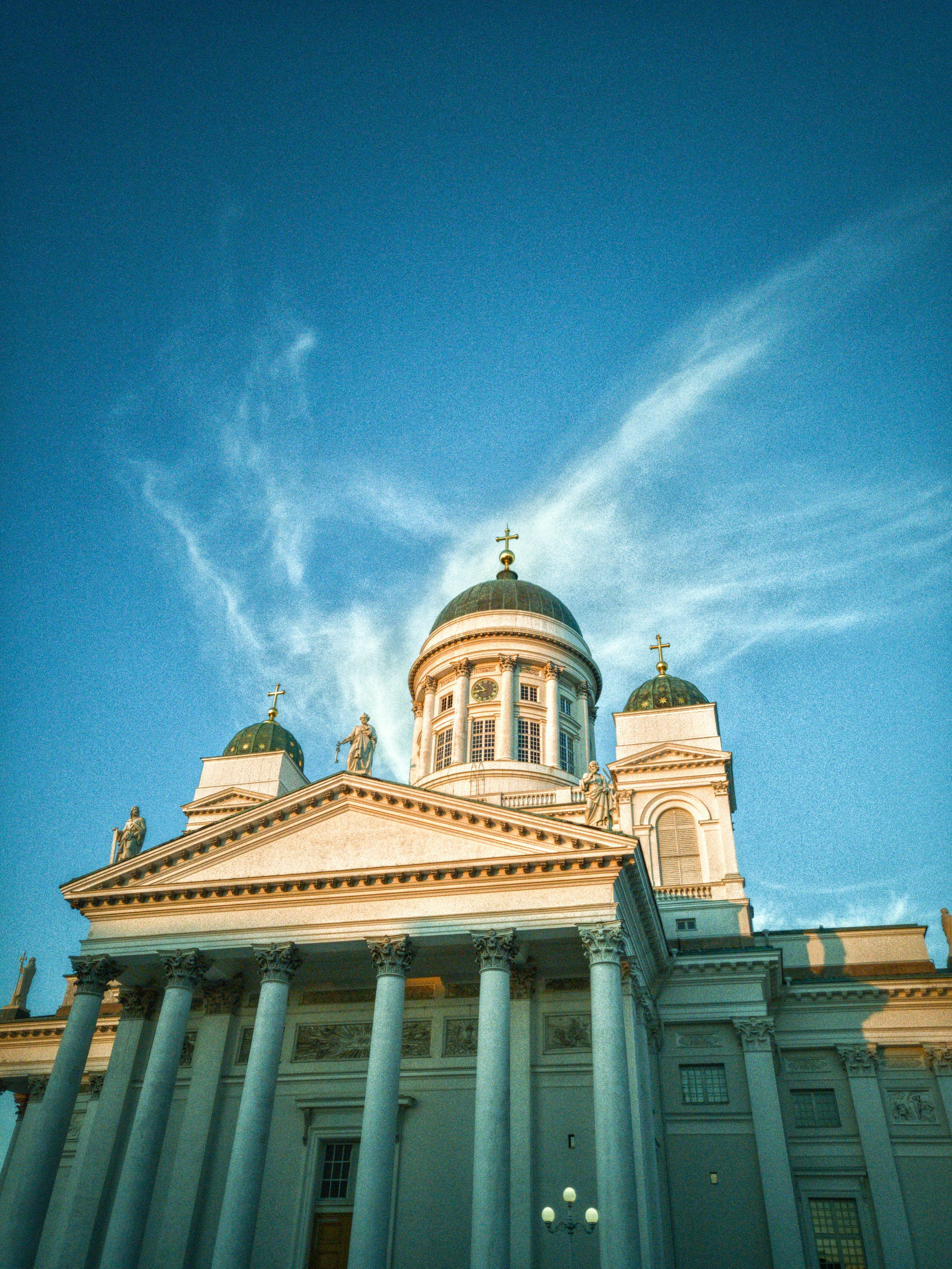 white and brown concrete building under blue sky during daytime
