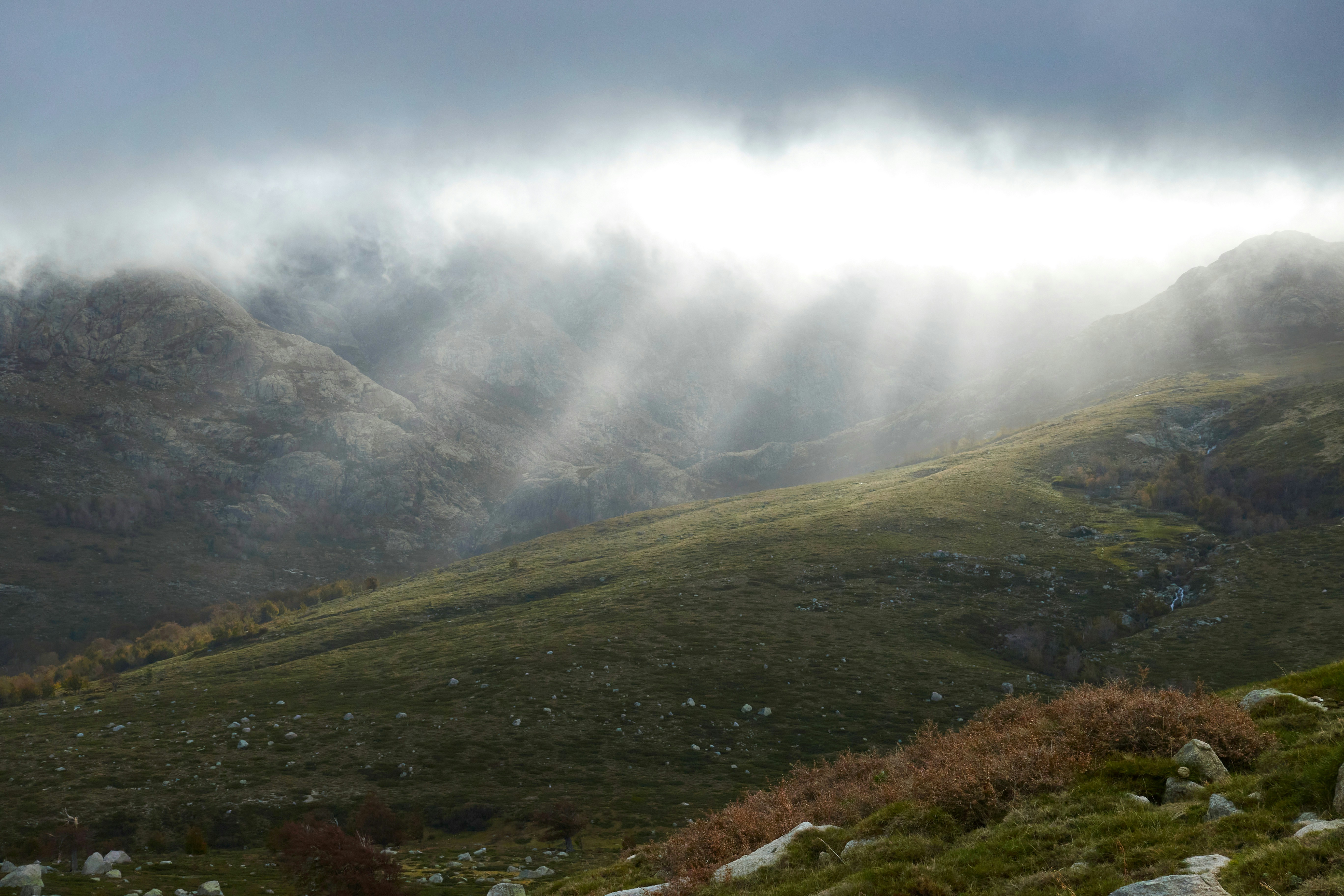 Beams of Emergence: A Highland Ridge Lit by Narrow Sunbreaks