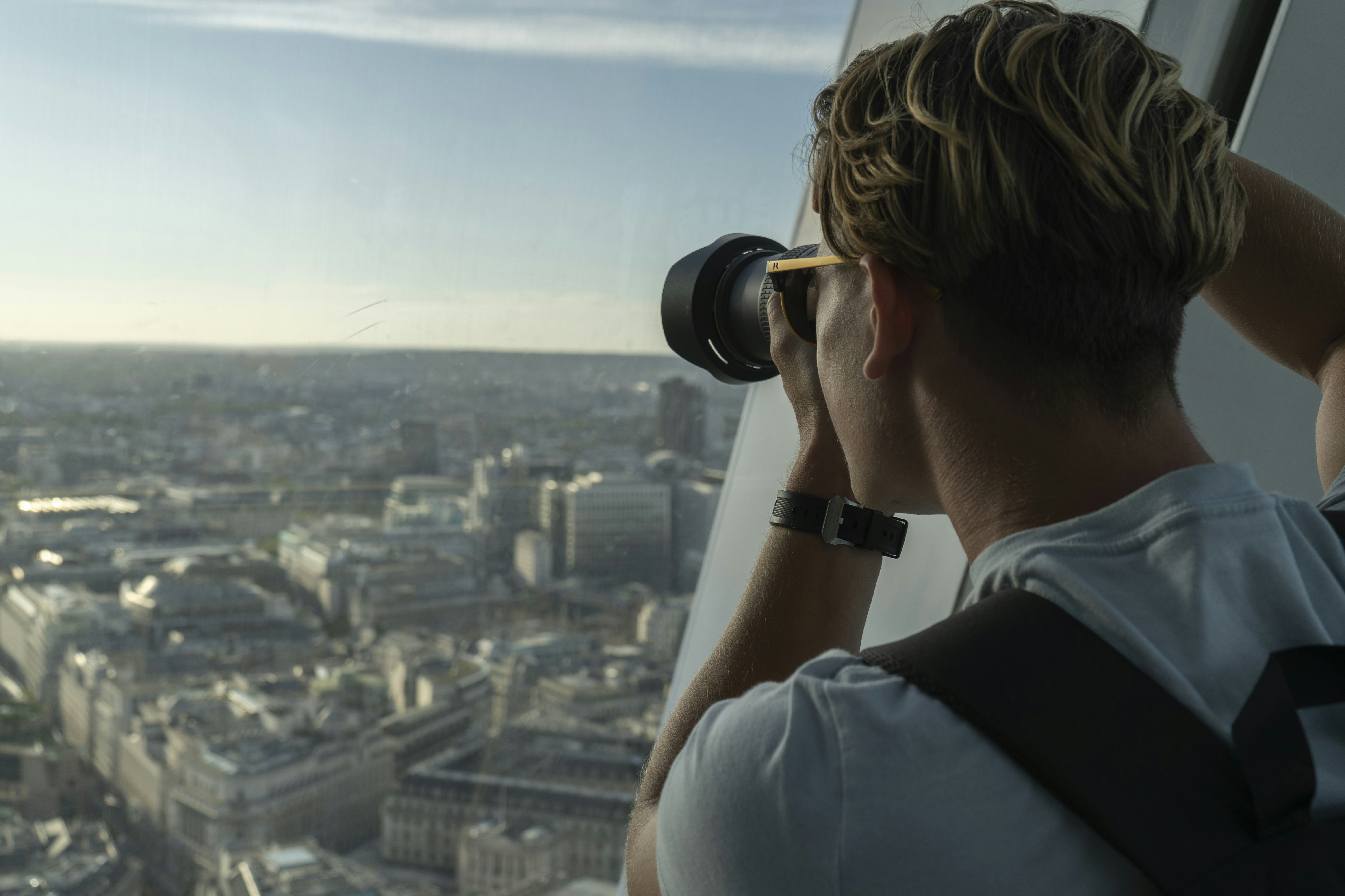Windowed Gaze: A Photographer Framing the City from Above
