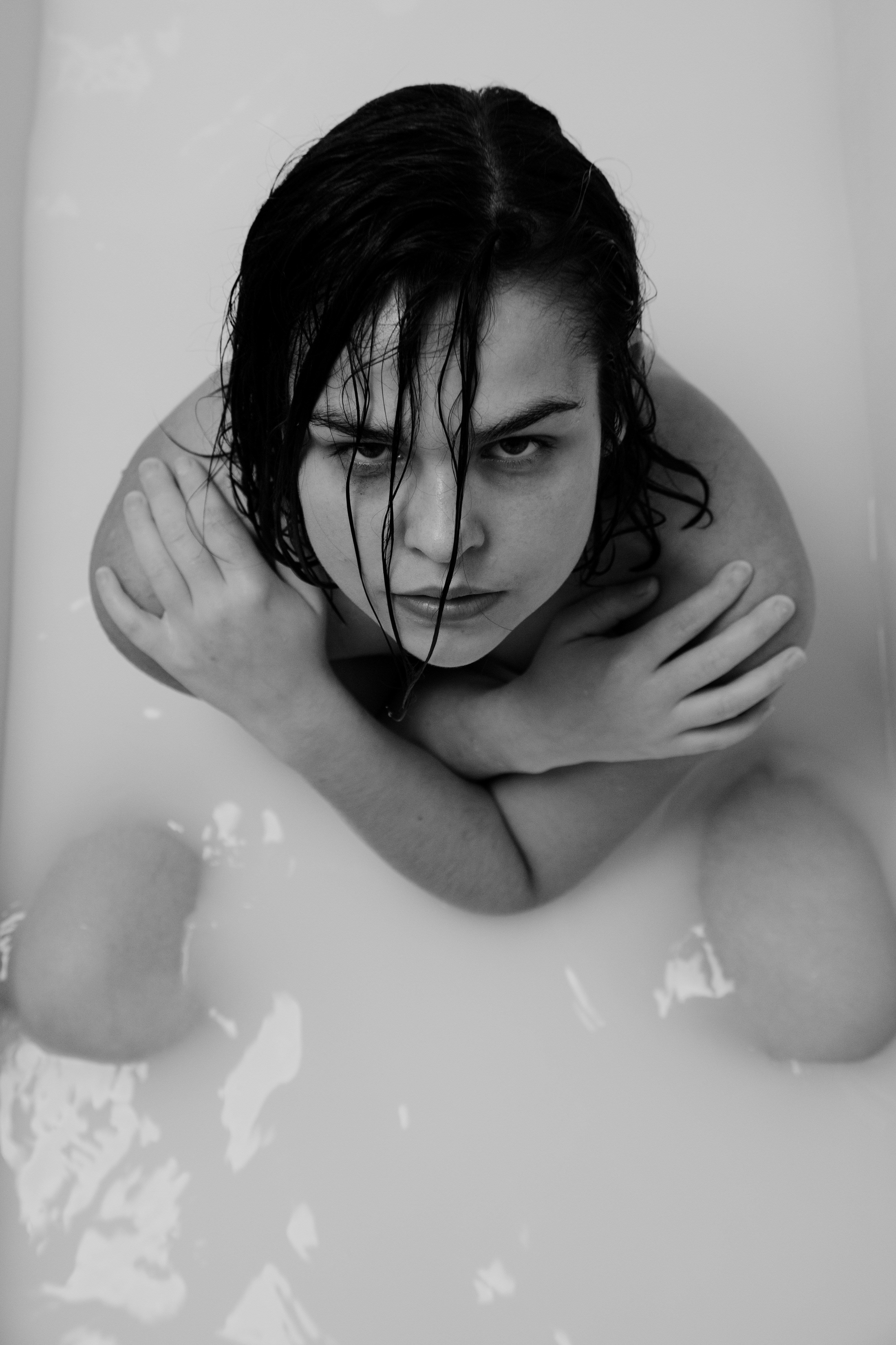 Gaze Beneath Wet Strands: A Noir Bathtub Portrait