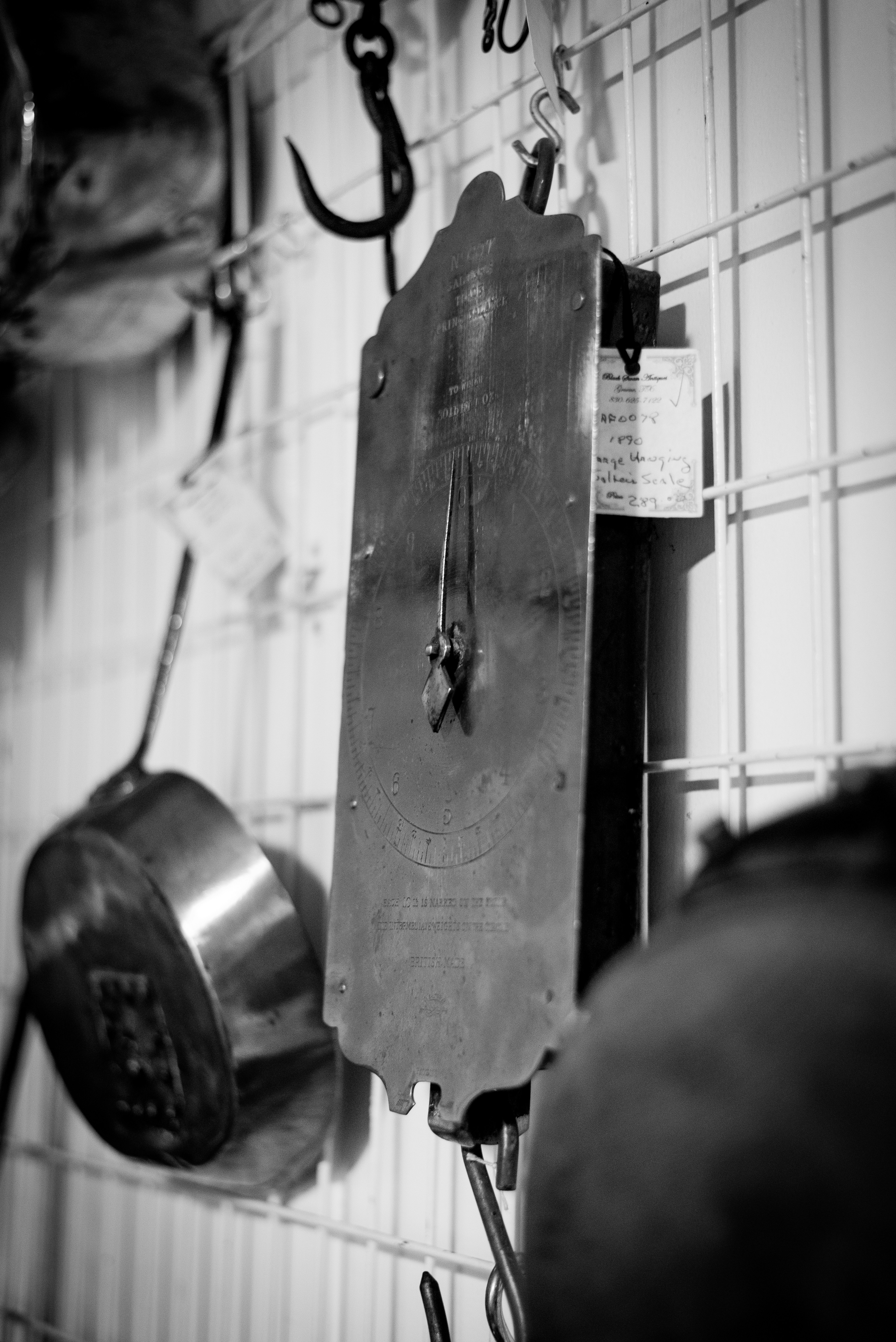 grayscale photo of a person holding a round container