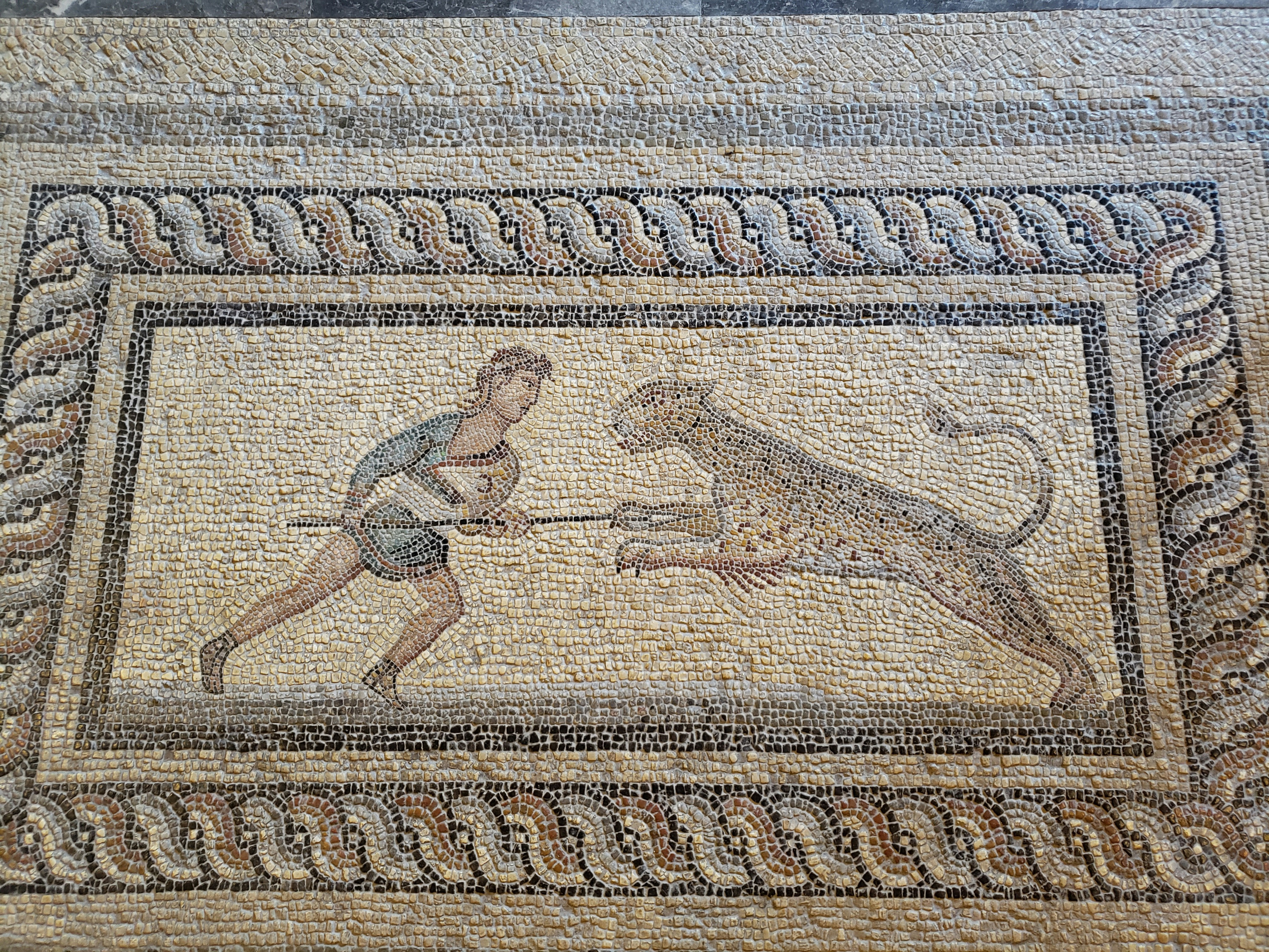 Ancient Struggle: Warrior Versus Beast in Mosaic Art
