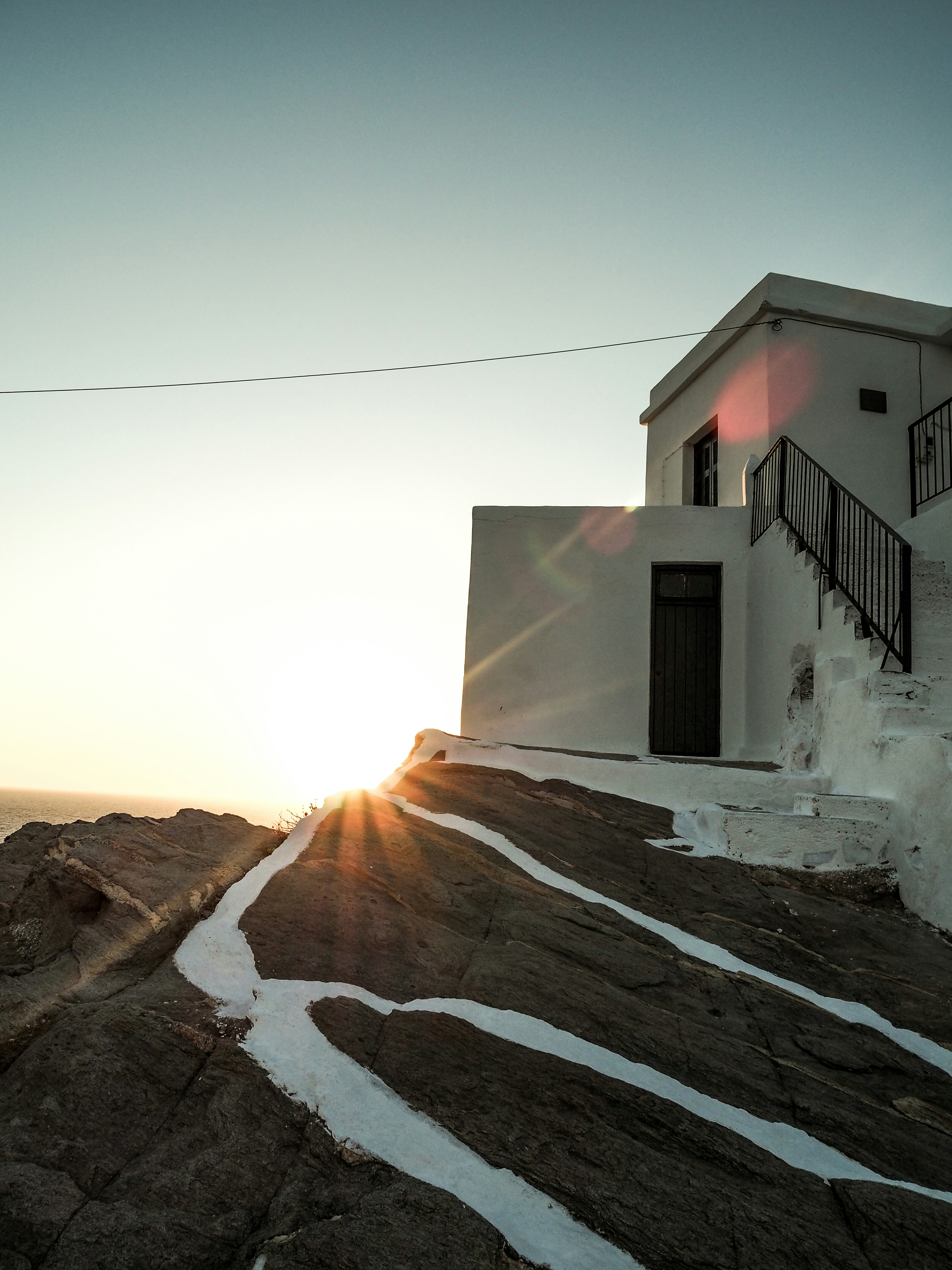 Sunrise Silhouette at the Cliffside Dwelling