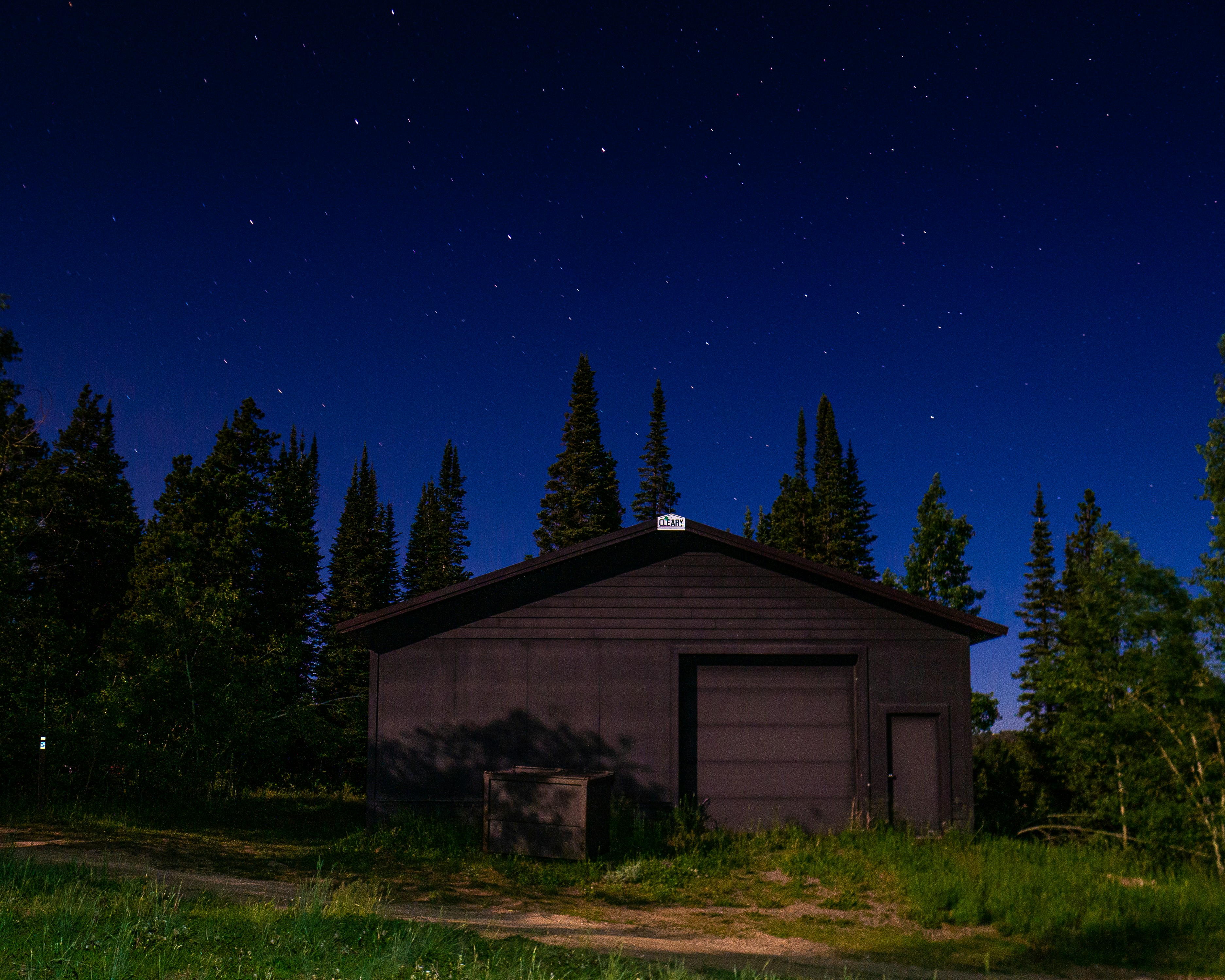 Nighttime Cabin Under a Starry Sky