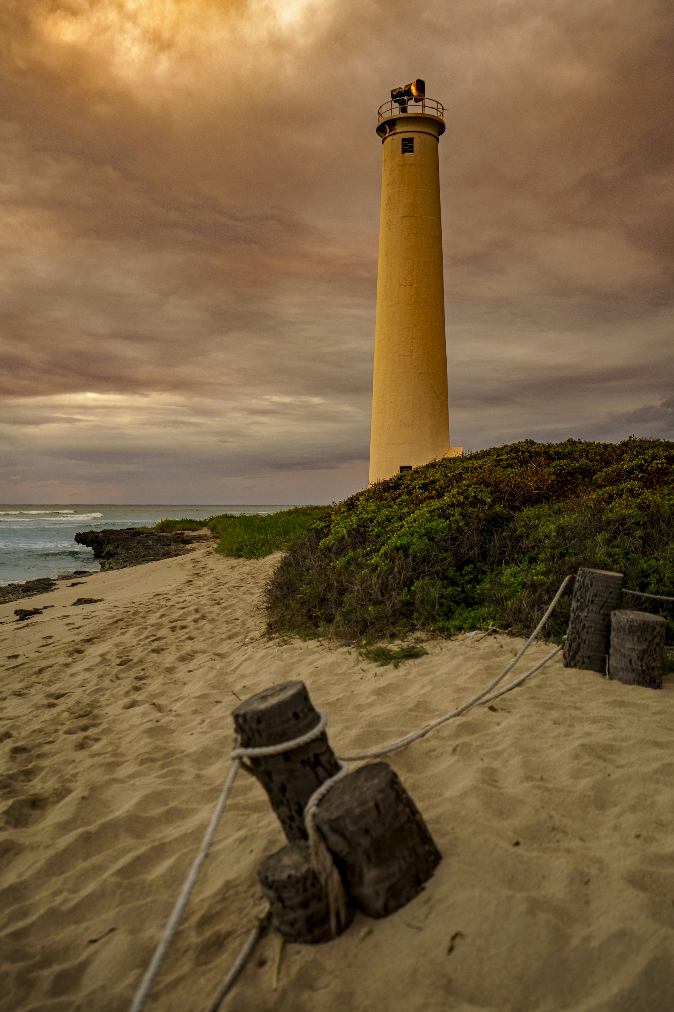 Lighthouse on the Edge: Golden Hour at the Dunes