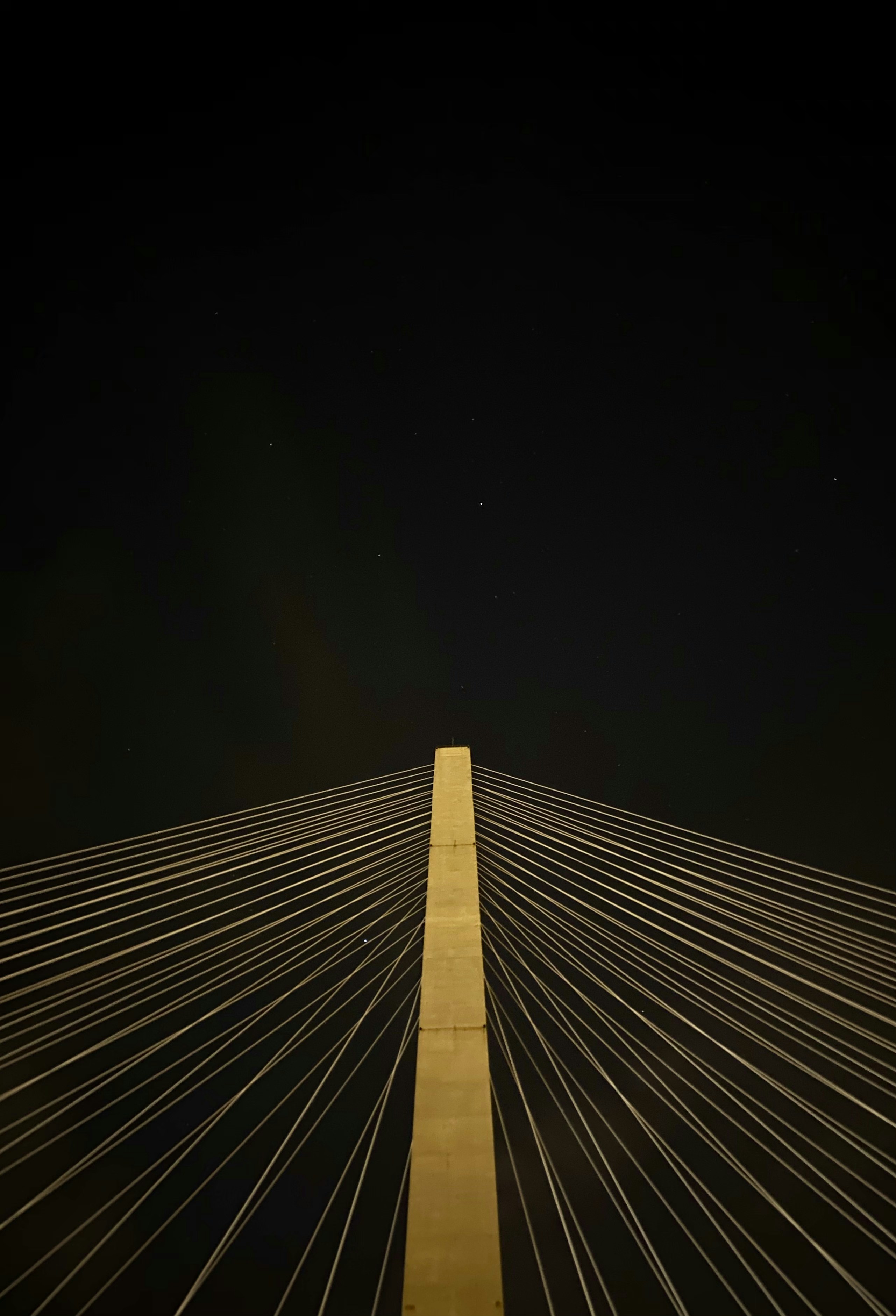 Centerline Convergence: Night Portrait of a Cable-Stayed Bridge Reaching Toward the Stars