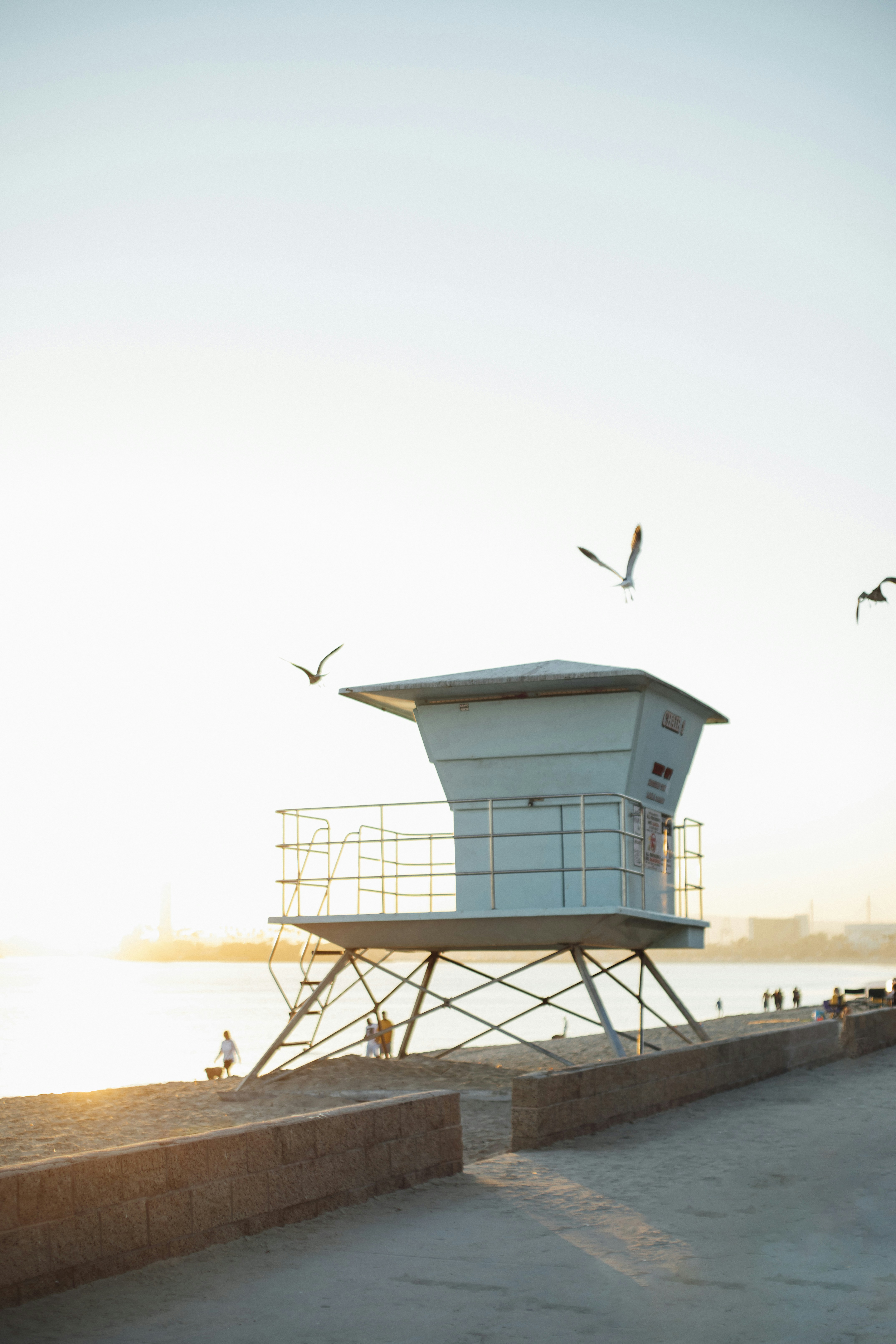 White wooden lifeguard house on beach during daytime photo – Free ...