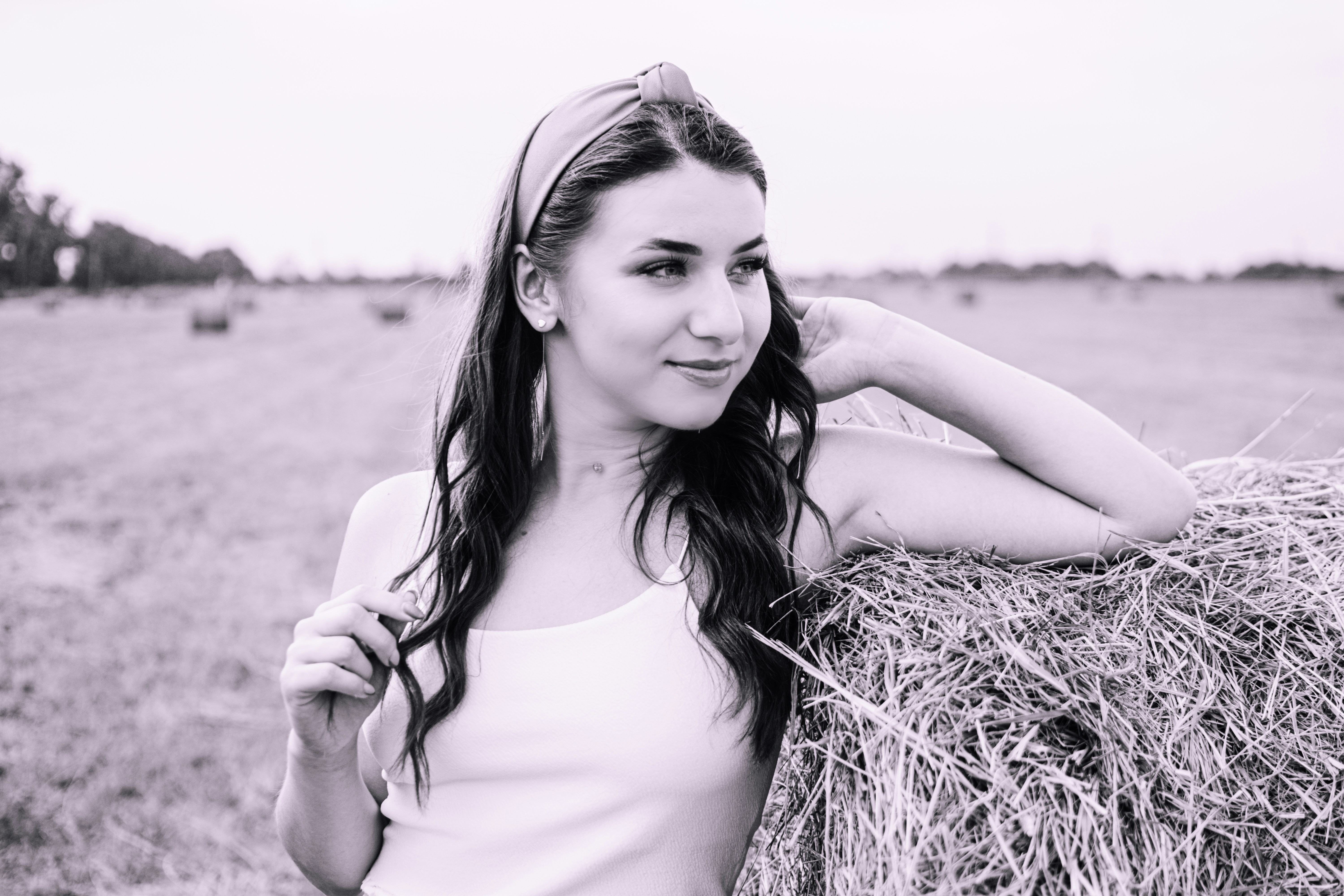 Hayfield Portrait: A Quiet Moment by the Straw Bale