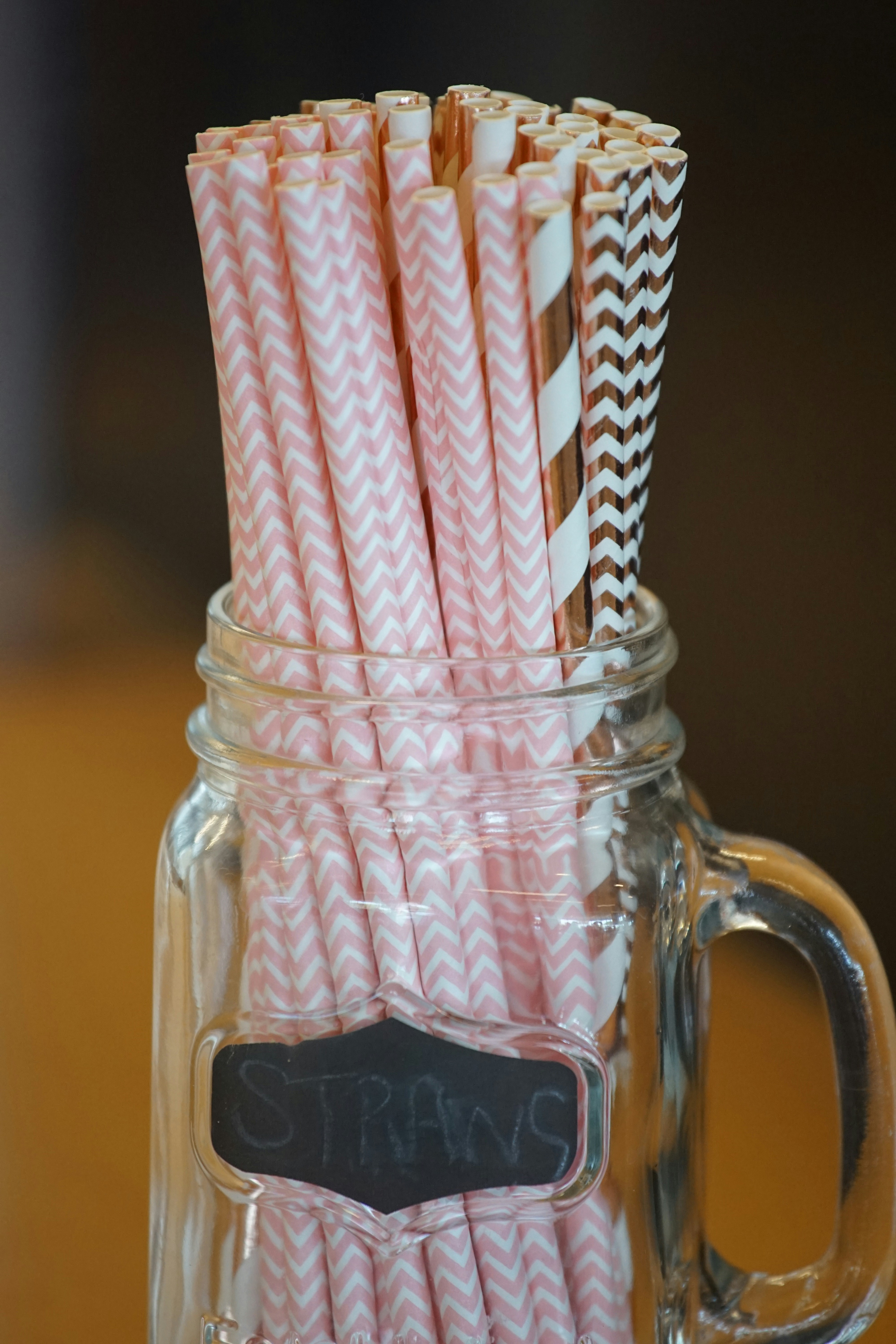 White and red striped candy sticks in clear glass mug photo – Free Food ...