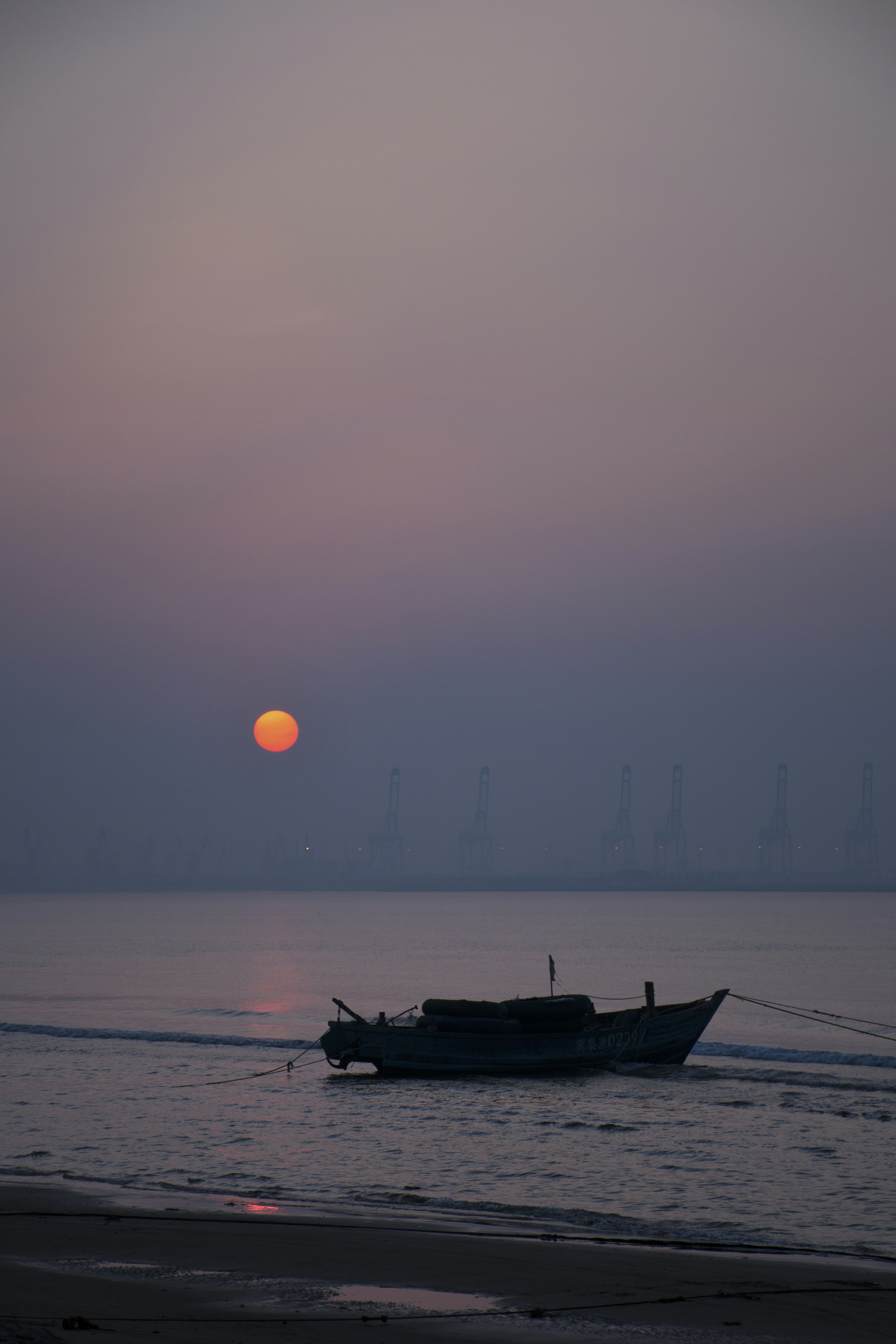 Sunlit Harbor: A Quiet Boat at Dusk