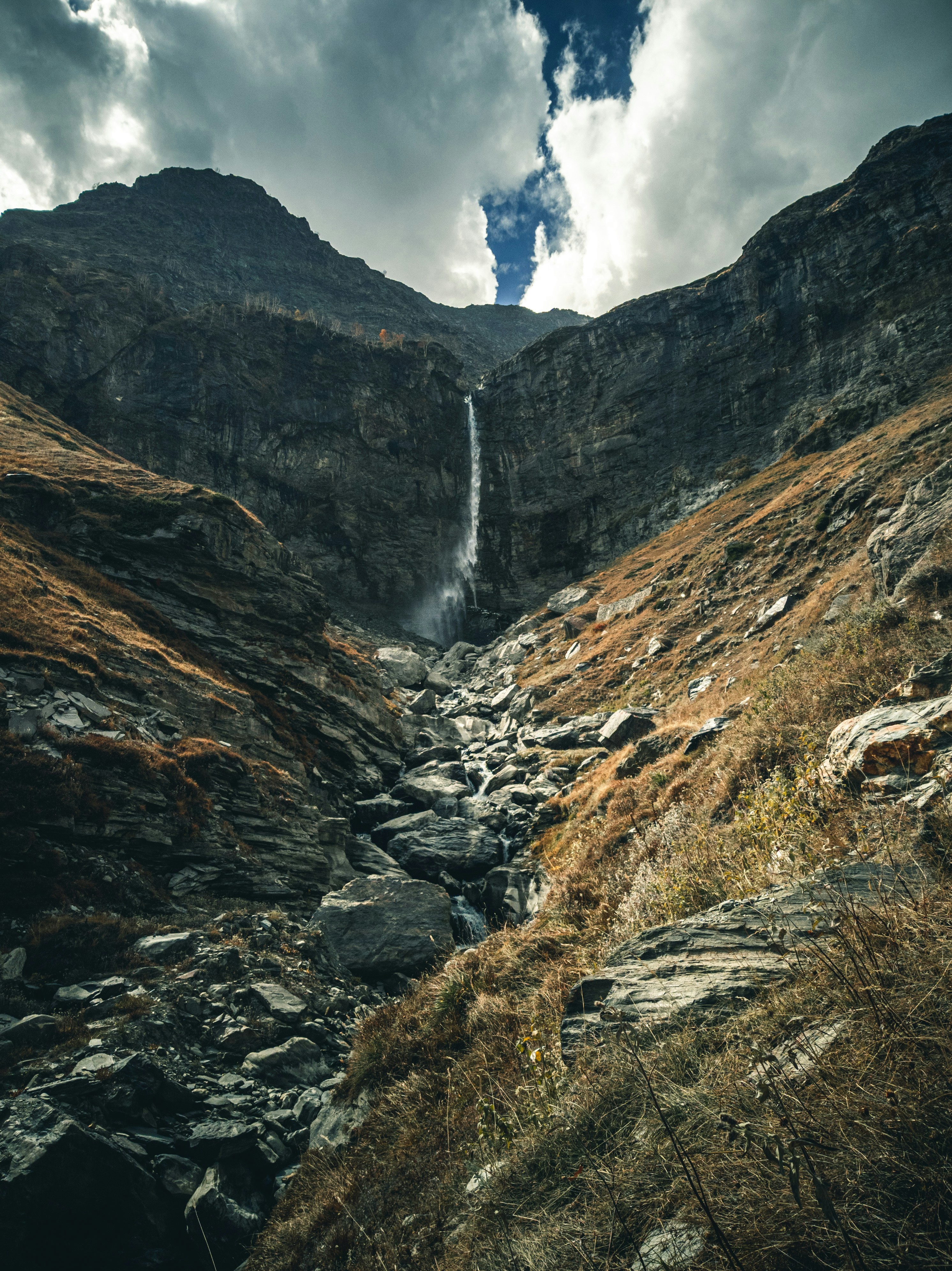 Waterfalls in the middle of rocky mountains photo – Free Waterfall ...