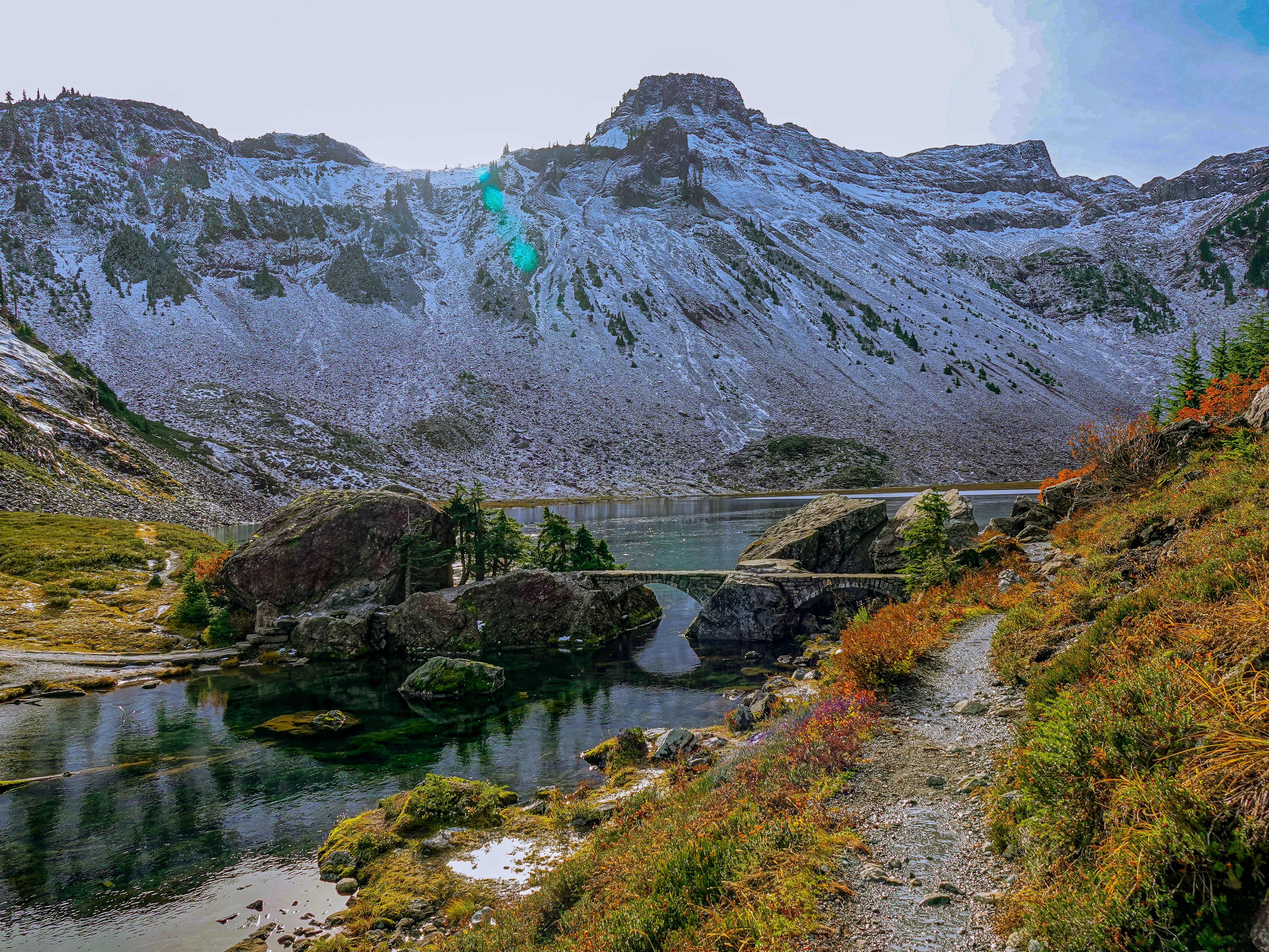Stone Ridge Over Lake: Alpine Pass with Moonlit Peaks