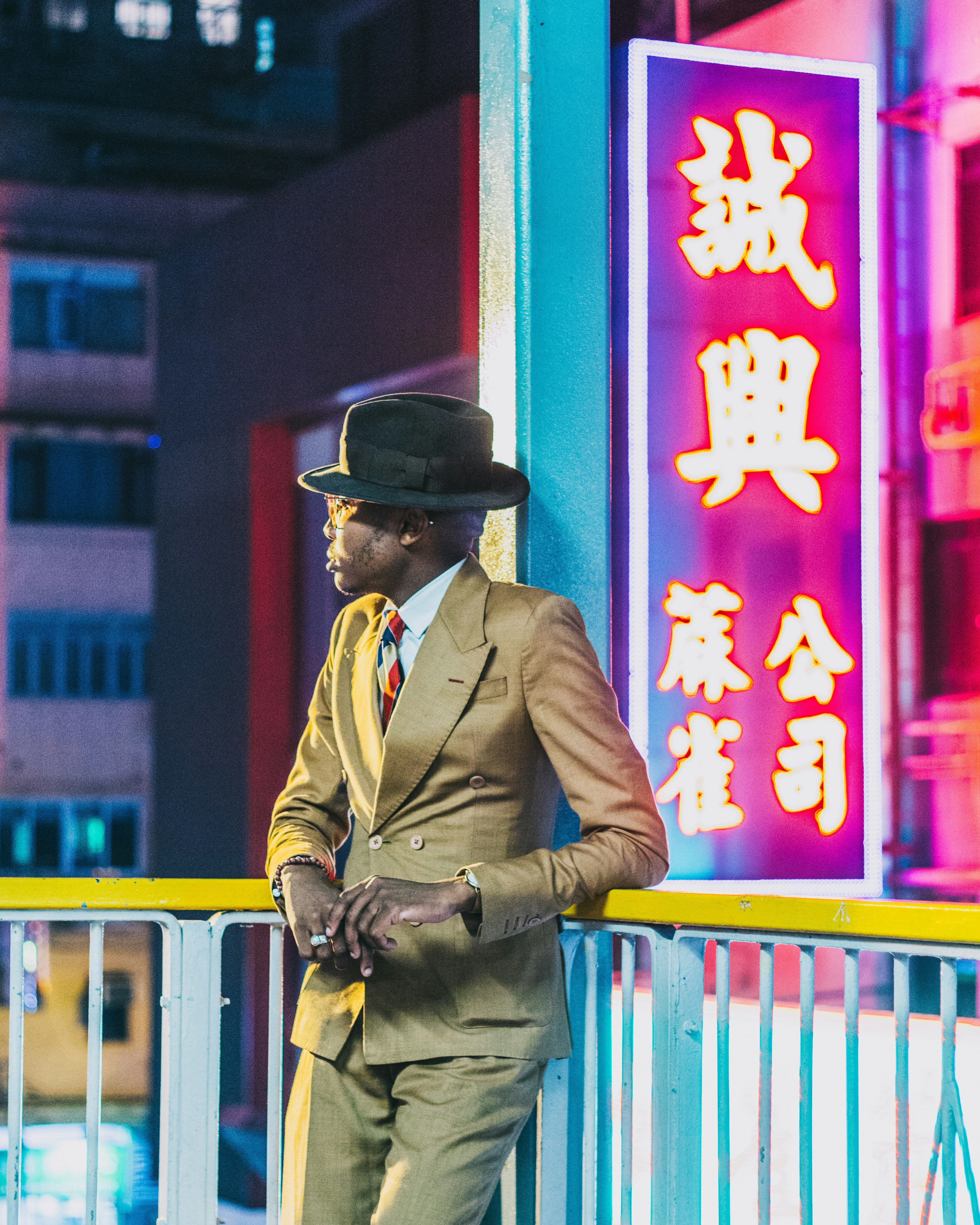 Neon Suited: A Quiet Figure in a Neon Chinatown
