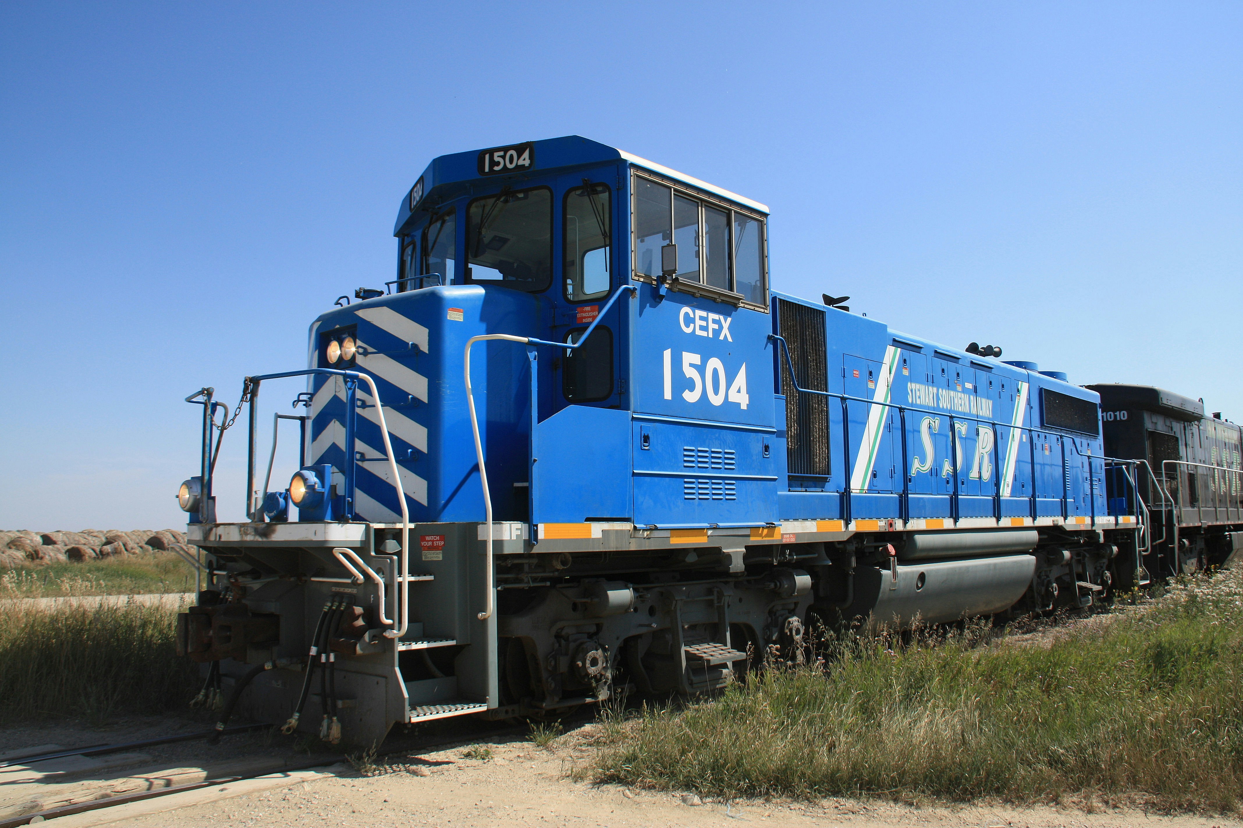 Blue and brown train on rail tracks during daytime photo – Free ...