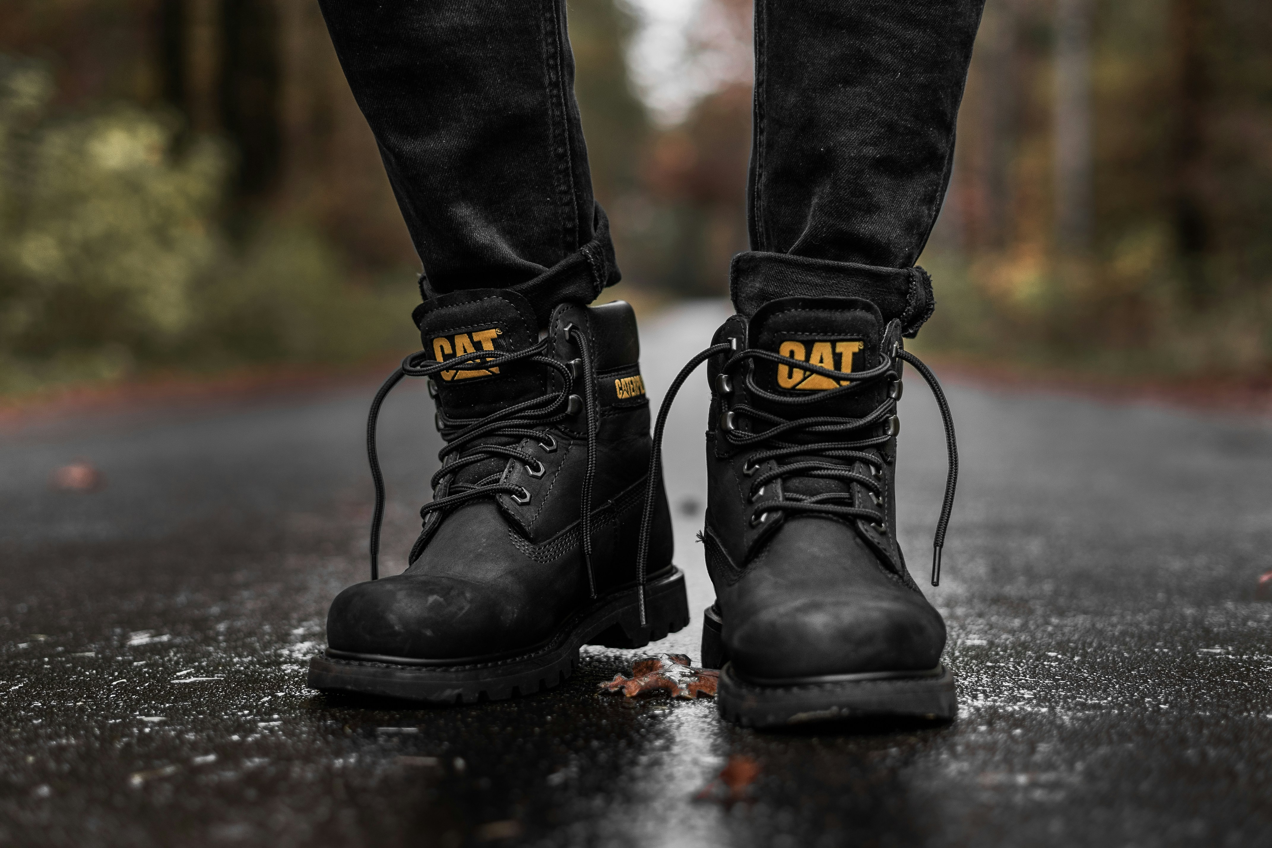 Boots on a Rain-Washed Road: A Grounded Close-Up in the Woods