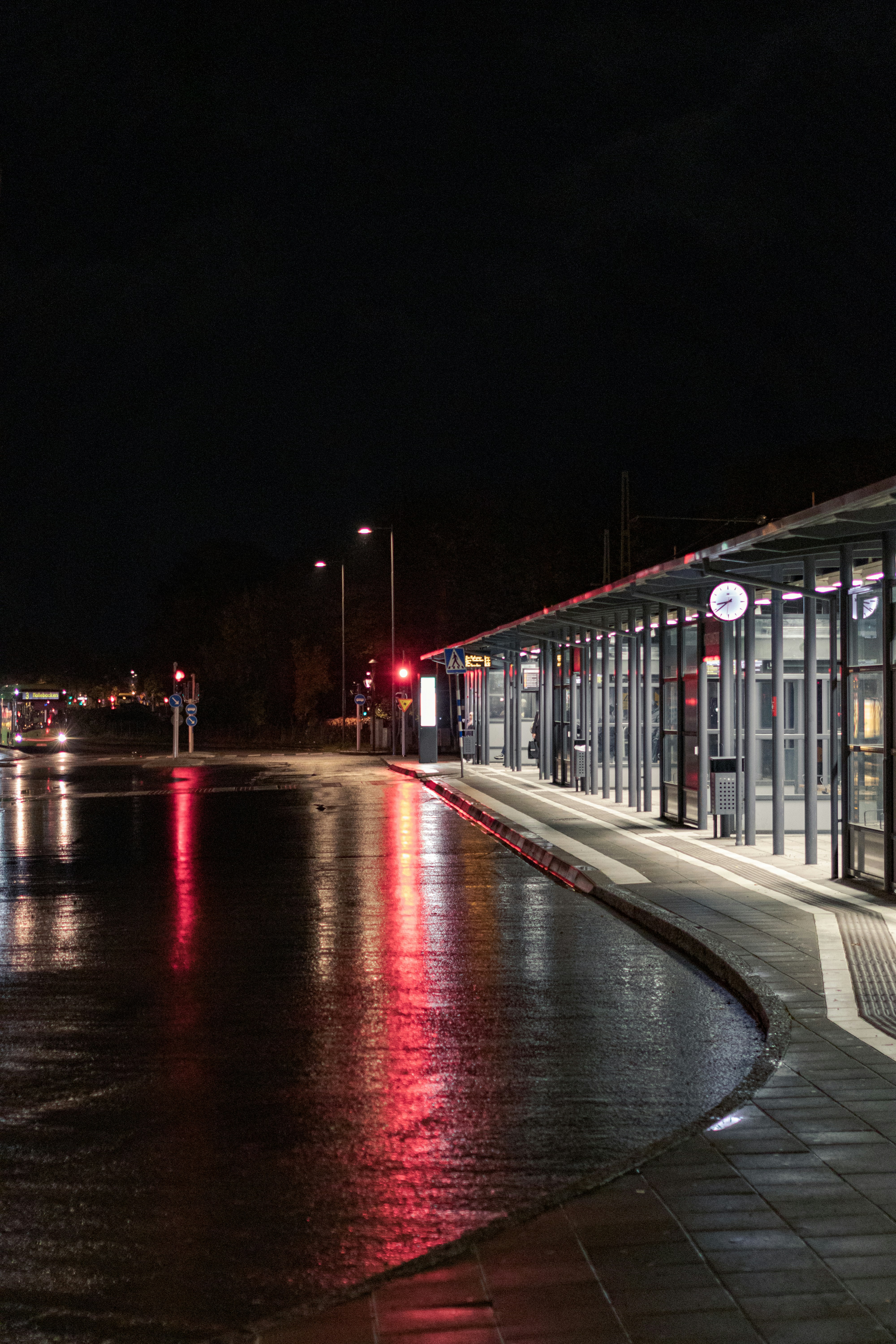 Night Station: Neon Ripples Along a Glass-Canopy Walkway