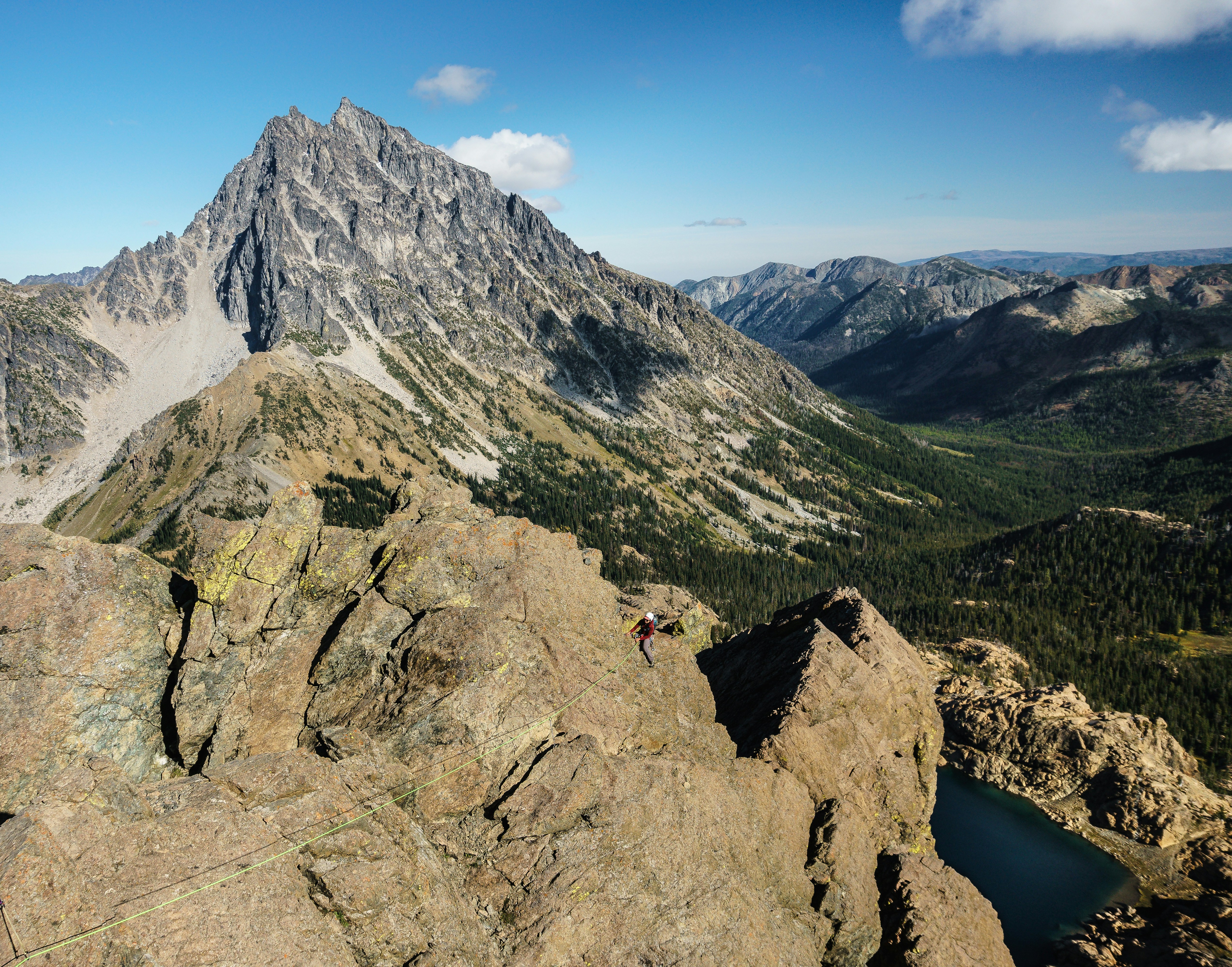 Partner climbing a ridge along Ingalls Peak in Washington US