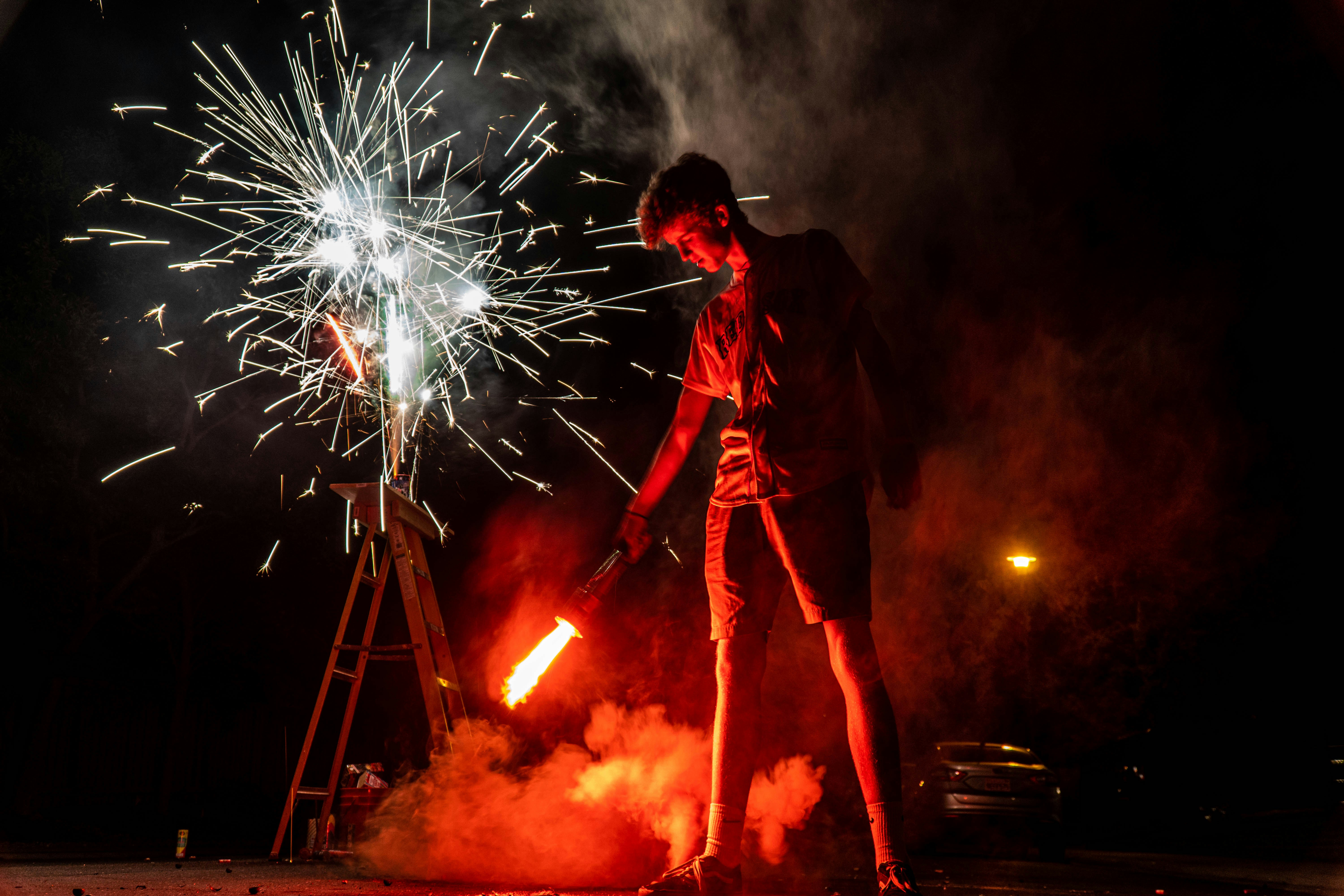 Fireworker in the Night: Sparks, Smoke, and a Silent Stare