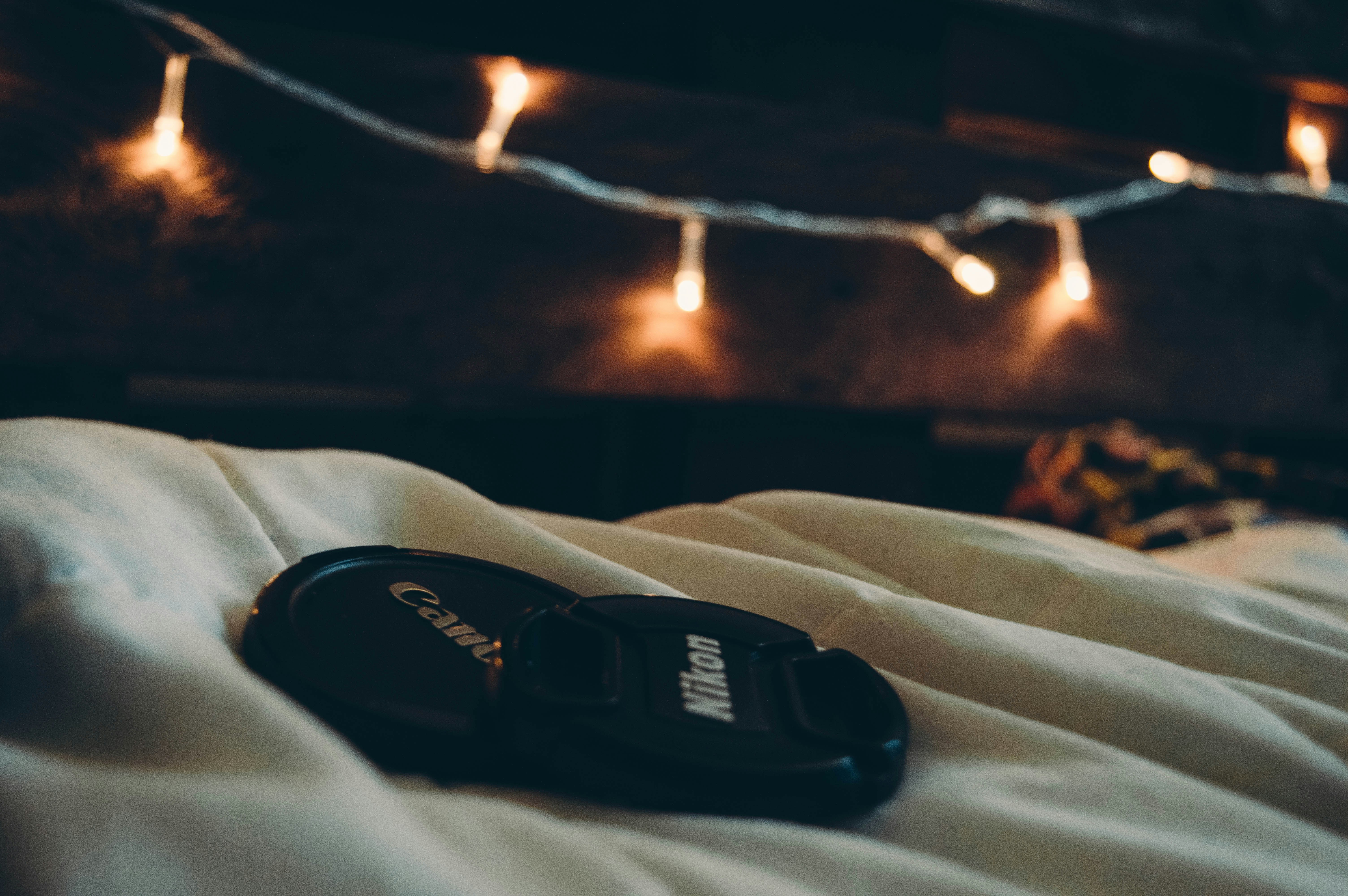 Soft Glow and Stillness: A Nikon Kit Resting Under Warm Fairy Lights