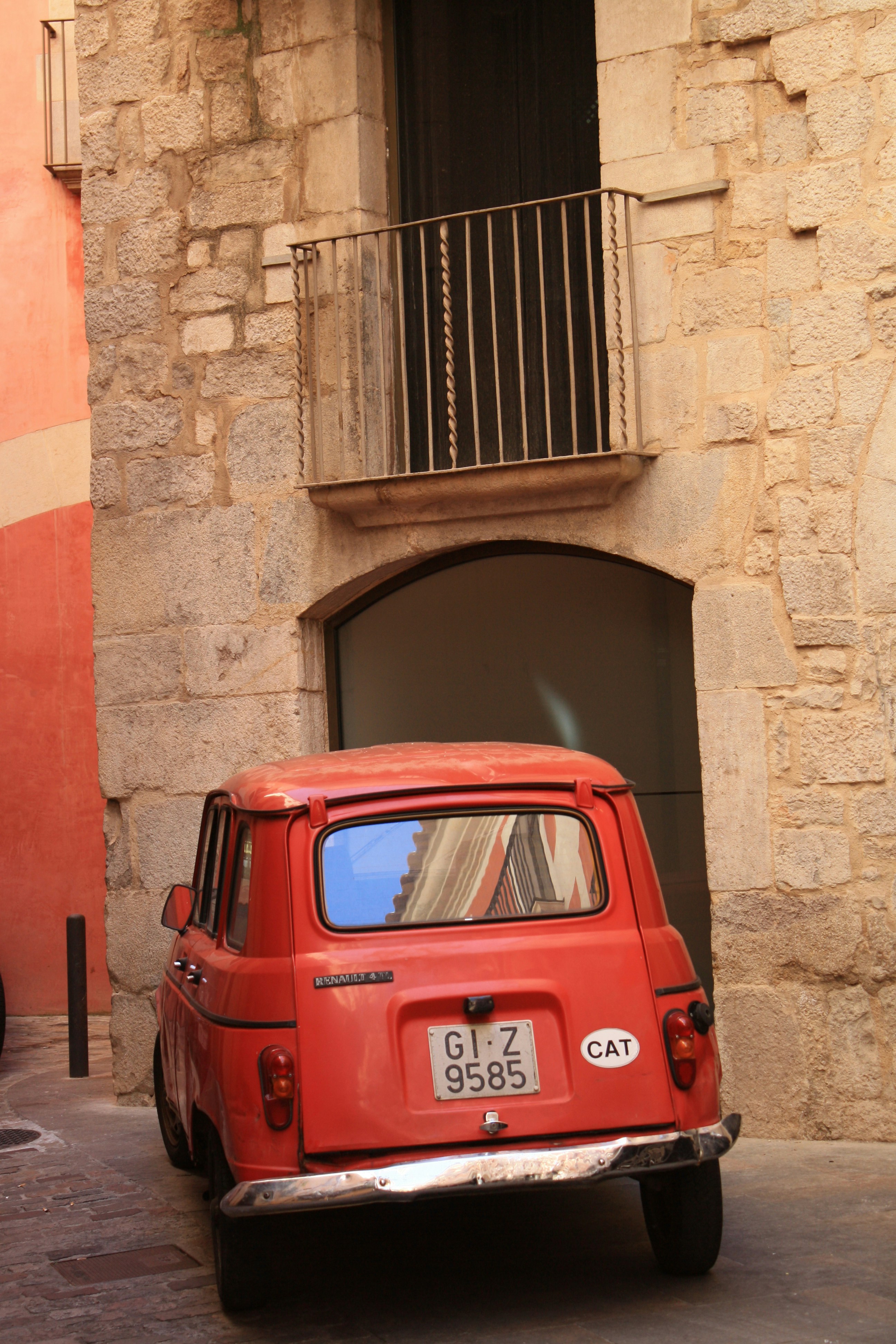 Crimson Classic in a Weathered Stone Alley