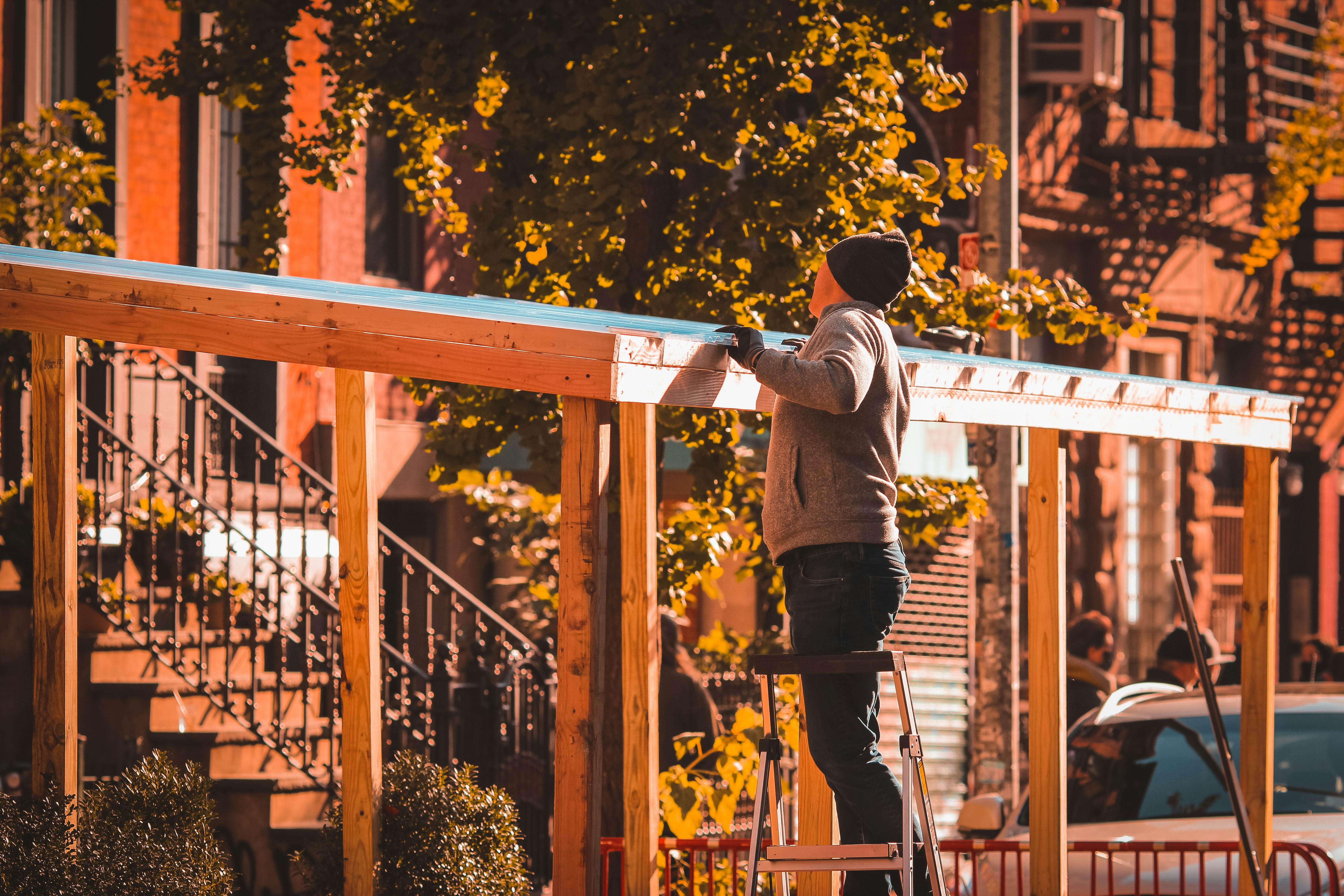 Ladder Work Under Autumn Streetlight