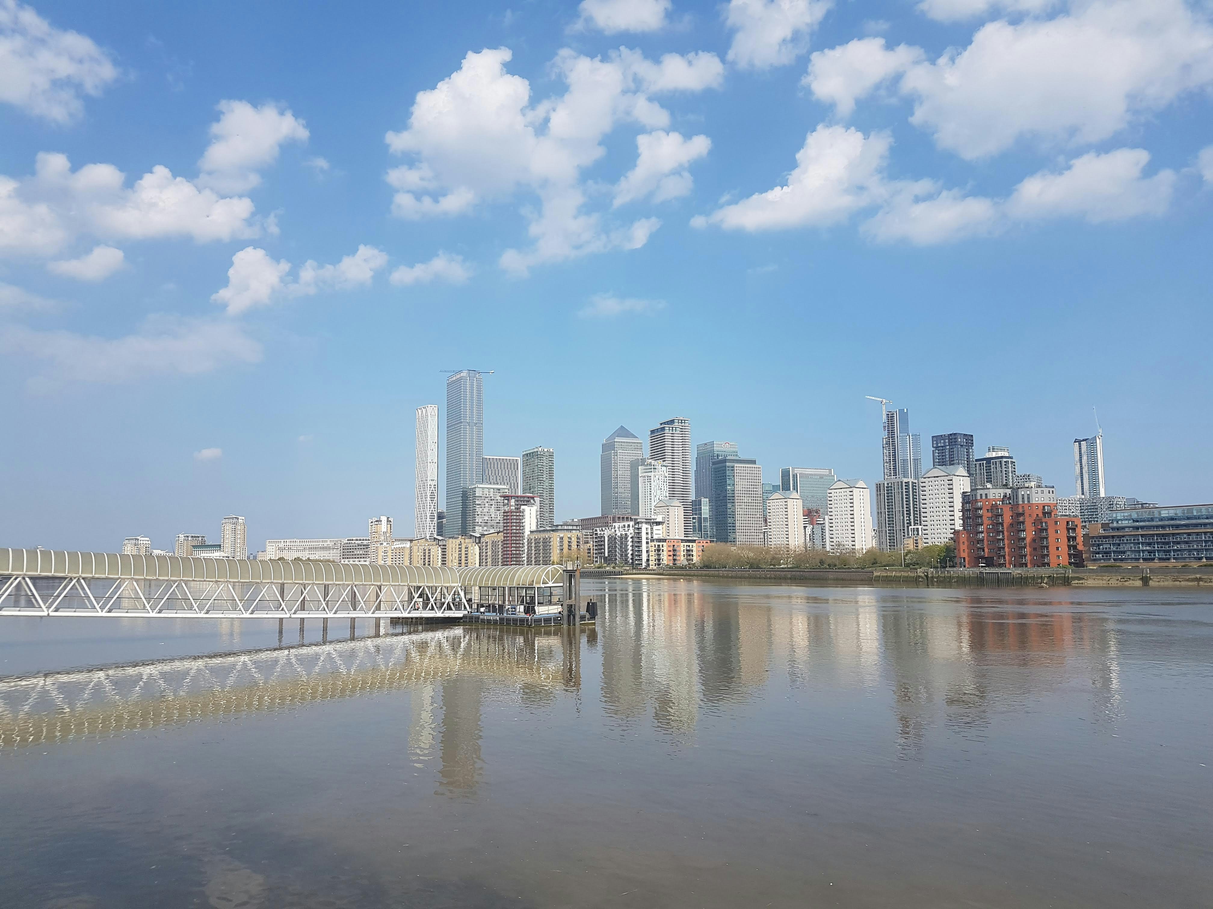 Horizon in Glass: Riverside Skyline and Bridge Reflections