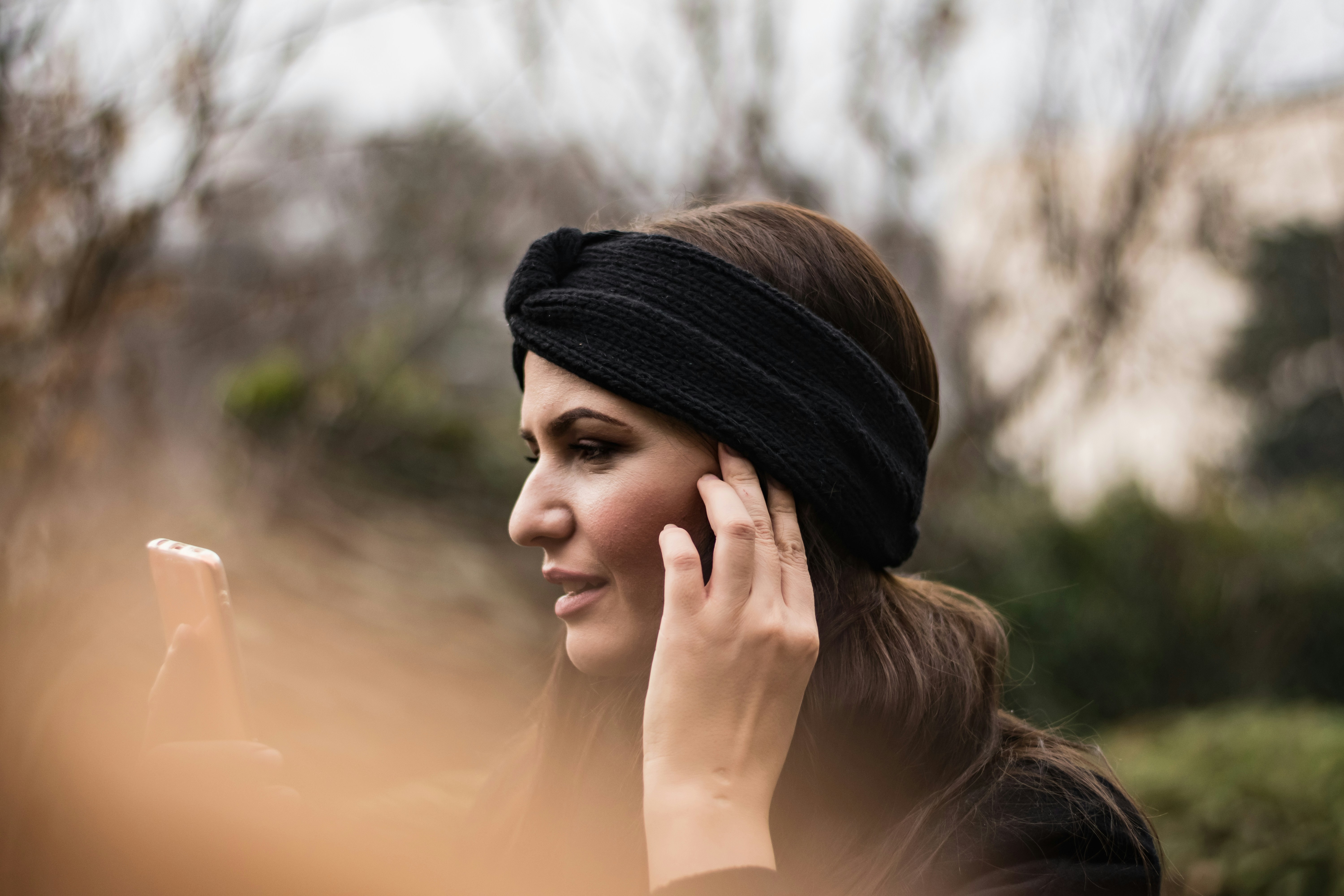 Soft-Focus Conversation: Portrait of a Woman in a Black Headband