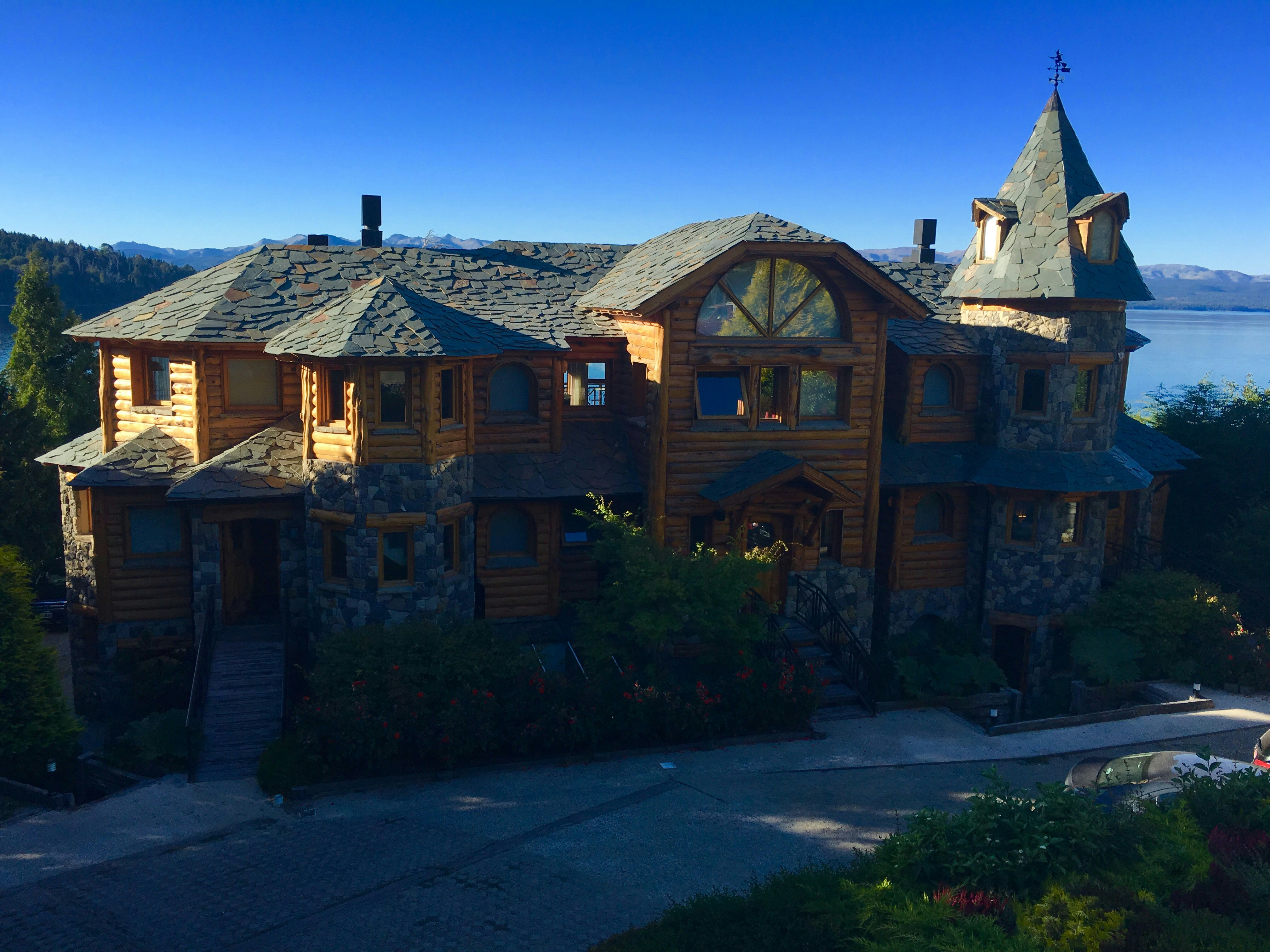 Lakeside Mansion Under Clear Skies