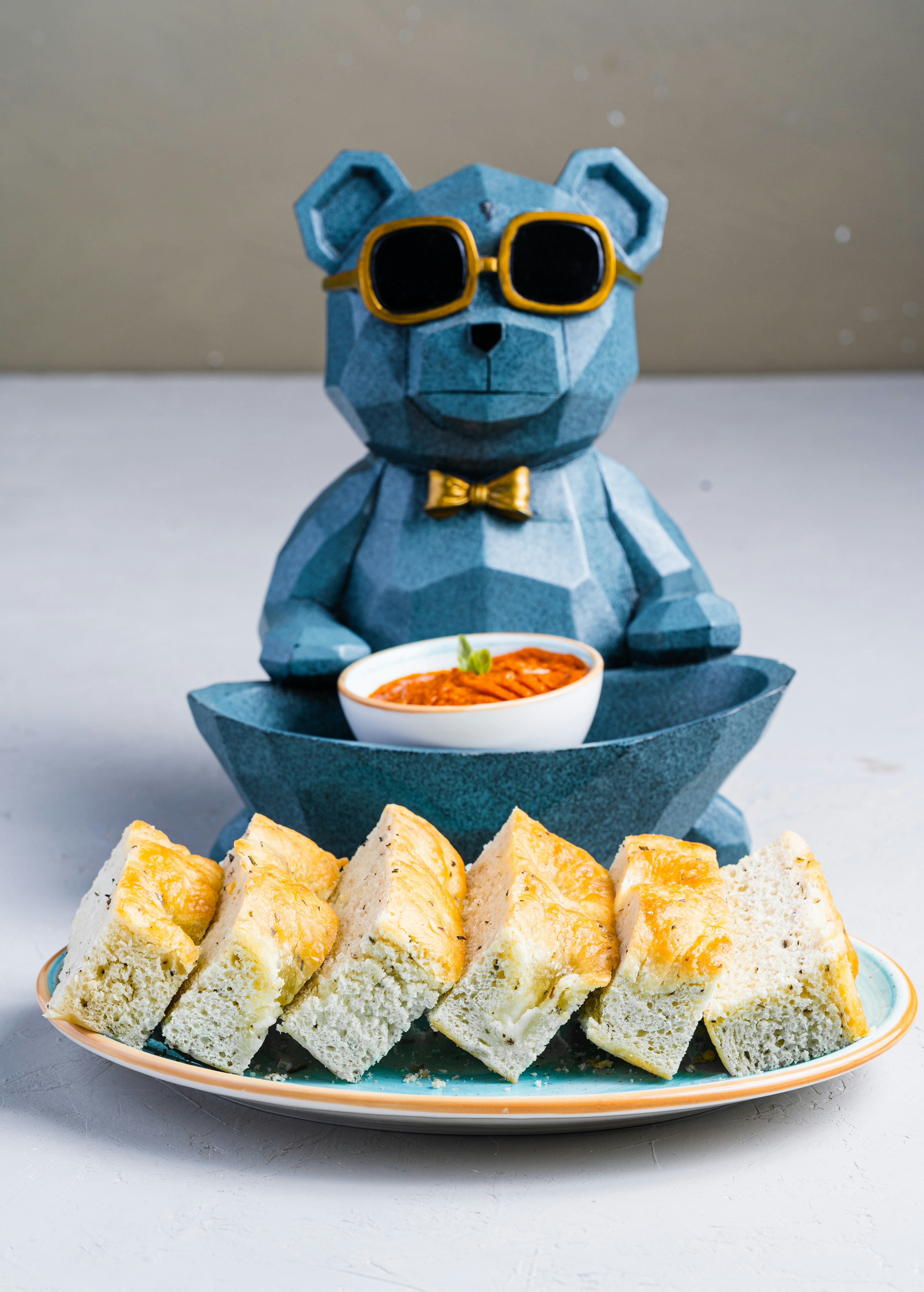 Geometric Blue Bear in Sunglasses Guards a Snack Dip - A Sculptural Snack Portrait