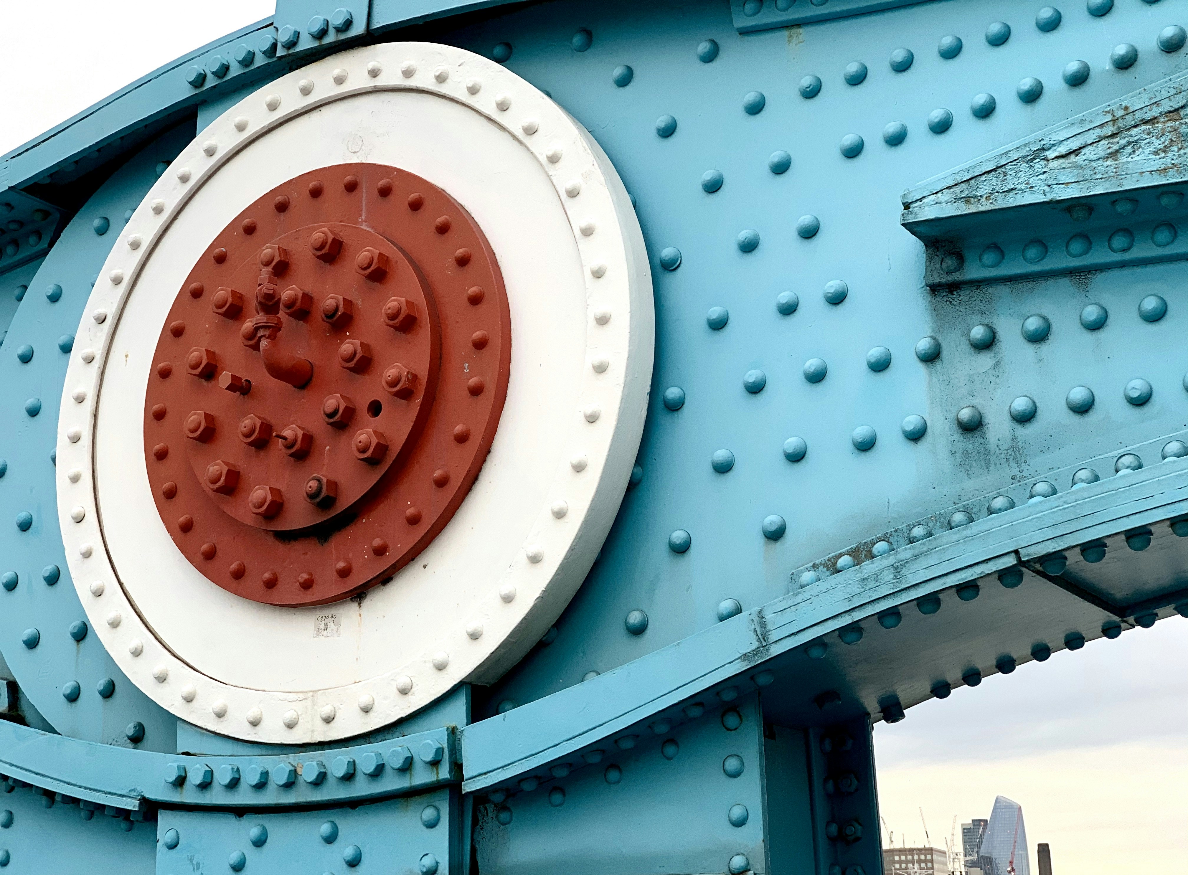 Riveted Blue Archframe with Central Red-Bolted Hub