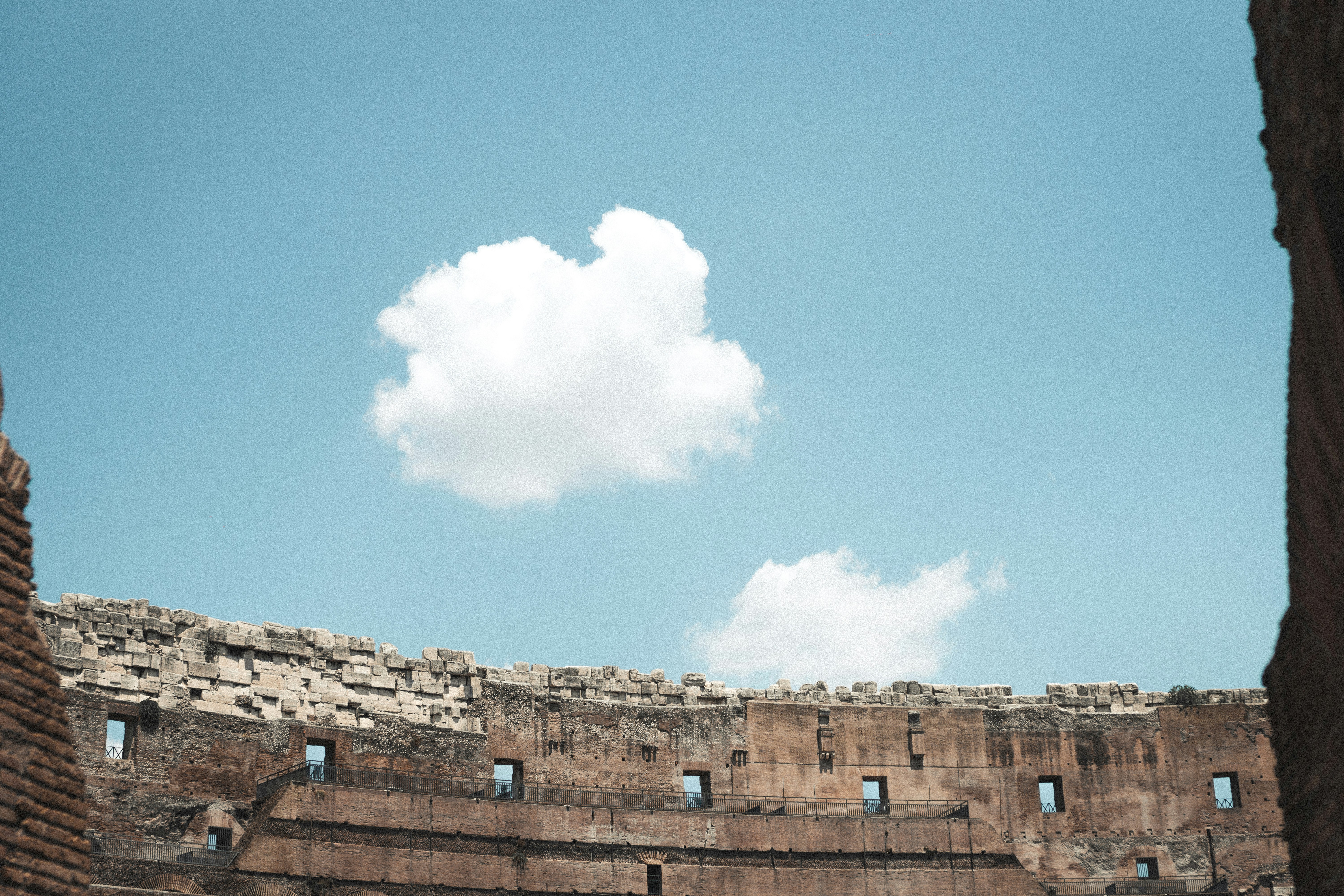 Cloud over ancient brick arches: a fragment of sky above the ruin