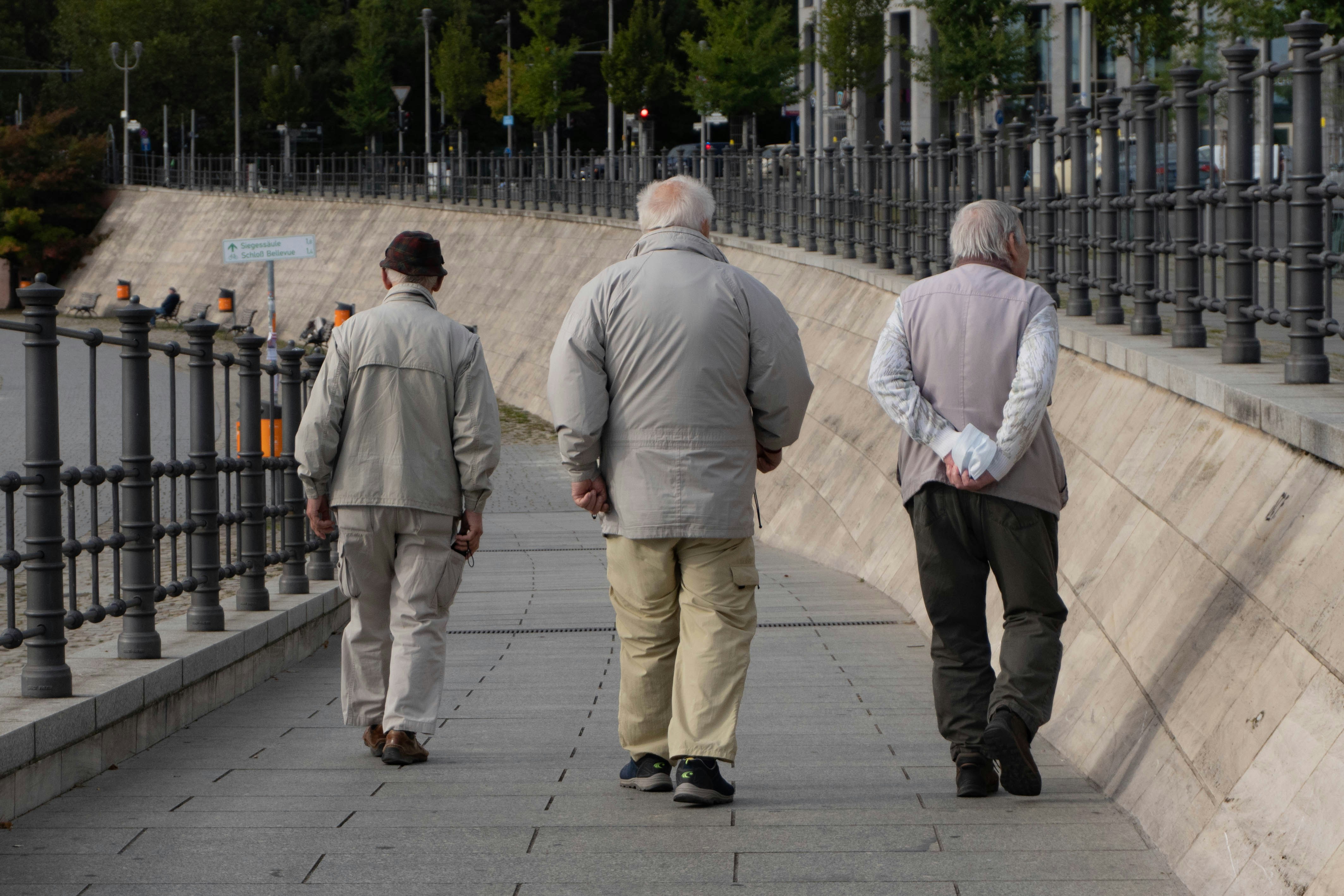 Man and woman walking on sidewalk during daytime photo – Free Grey ...